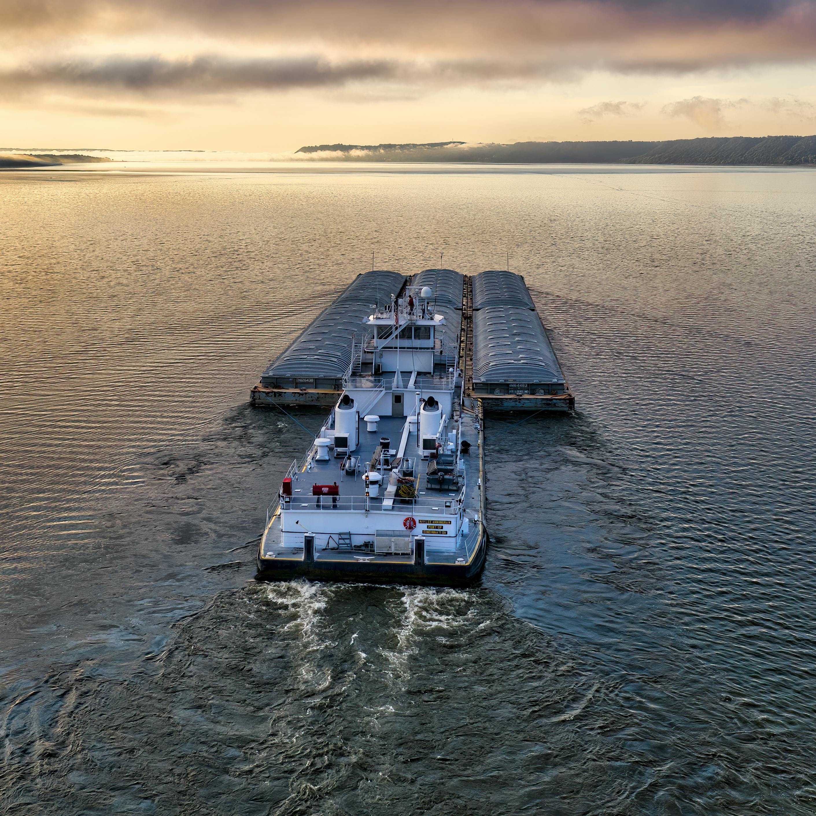Aerial View of a Barge on a Body of Water at Sunset · Free Stock Photo