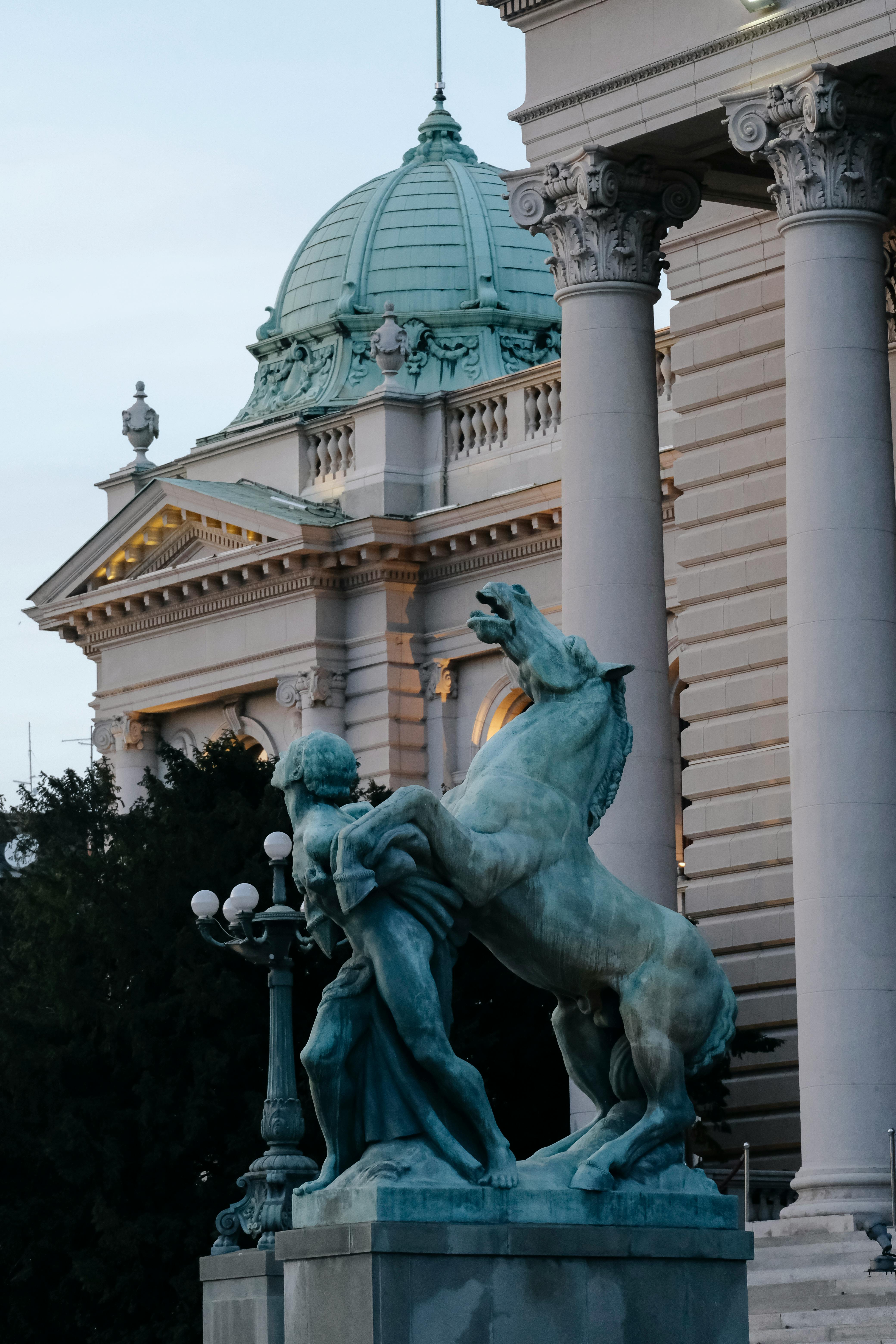 Green Copper Statues in front of House of the National Assembly of the ...