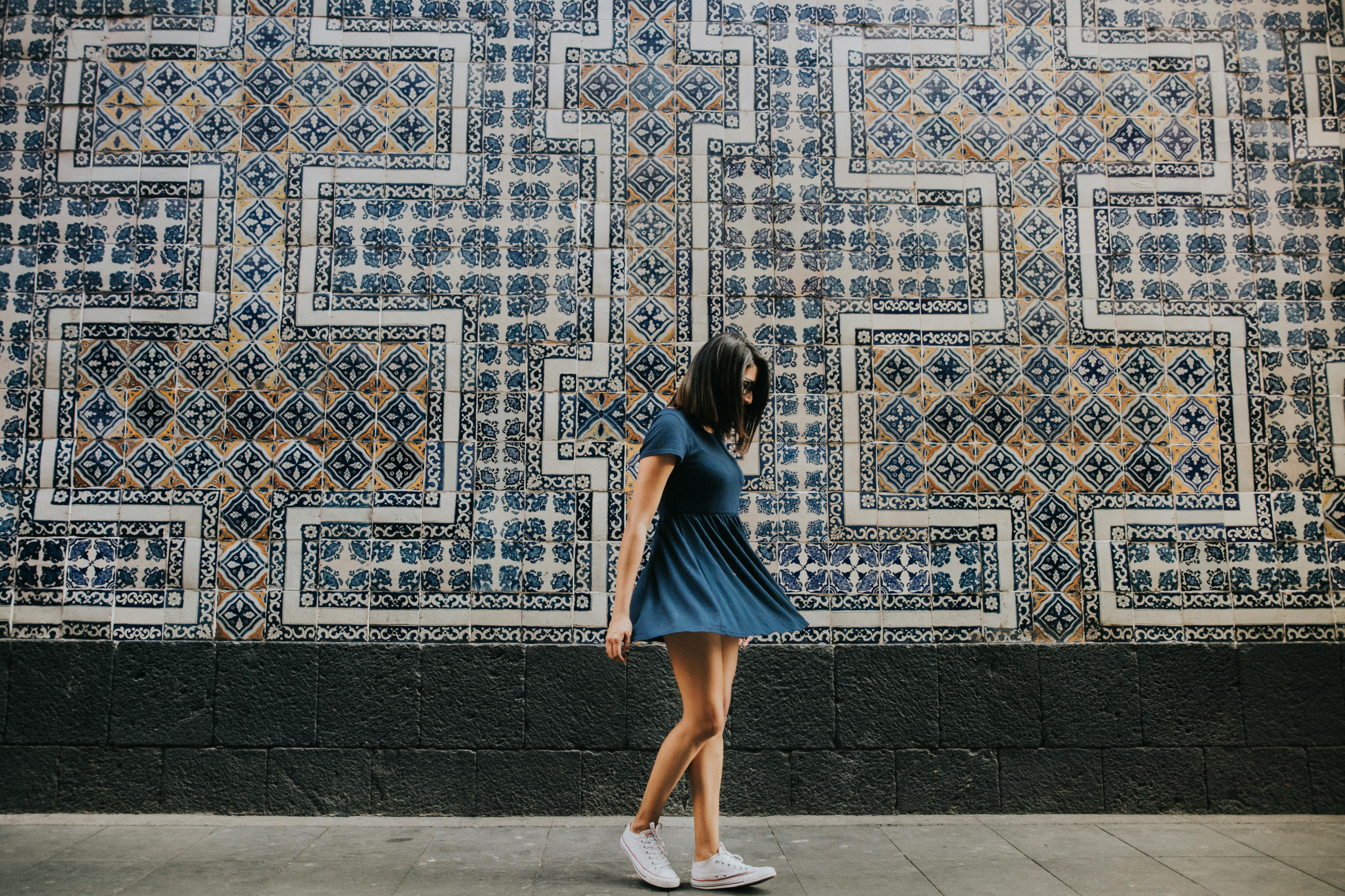 Woman Wearing A Dress Walking On Side Walk · Free Stock Photo