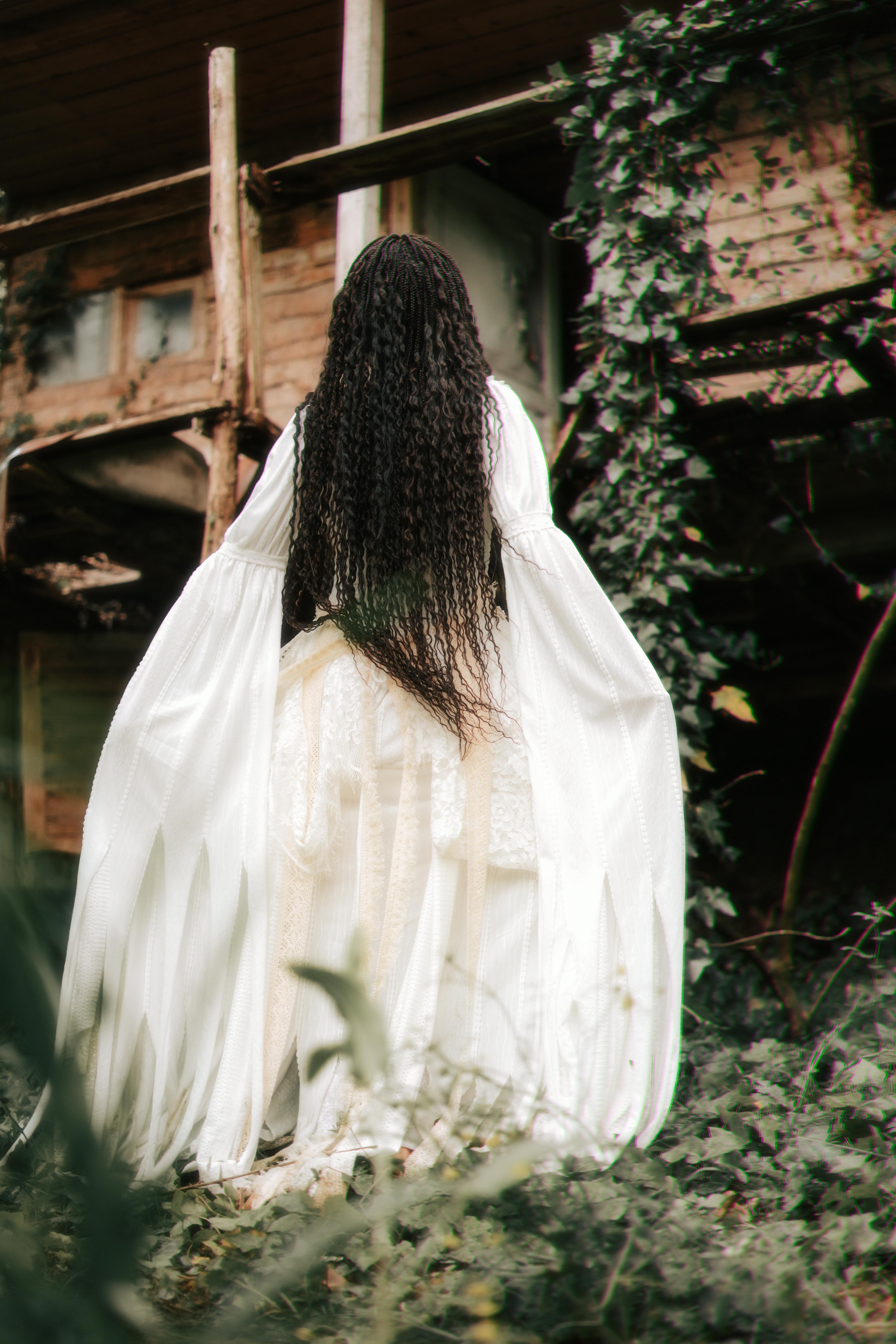 Ethereal Woman in White on Railway Bridge · Free Stock Photo