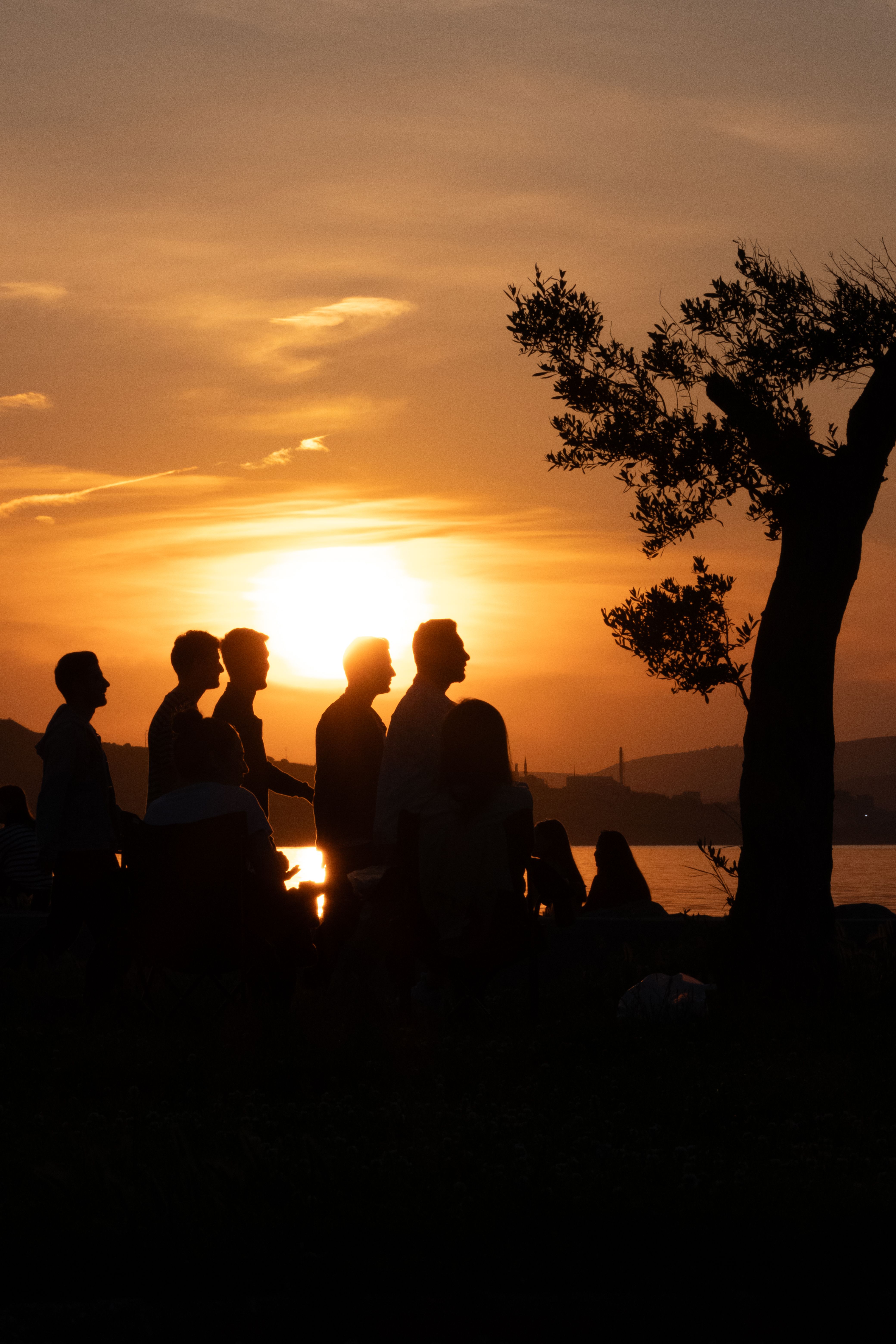 People Standing Outdoors at Sunset · Free Stock Photo