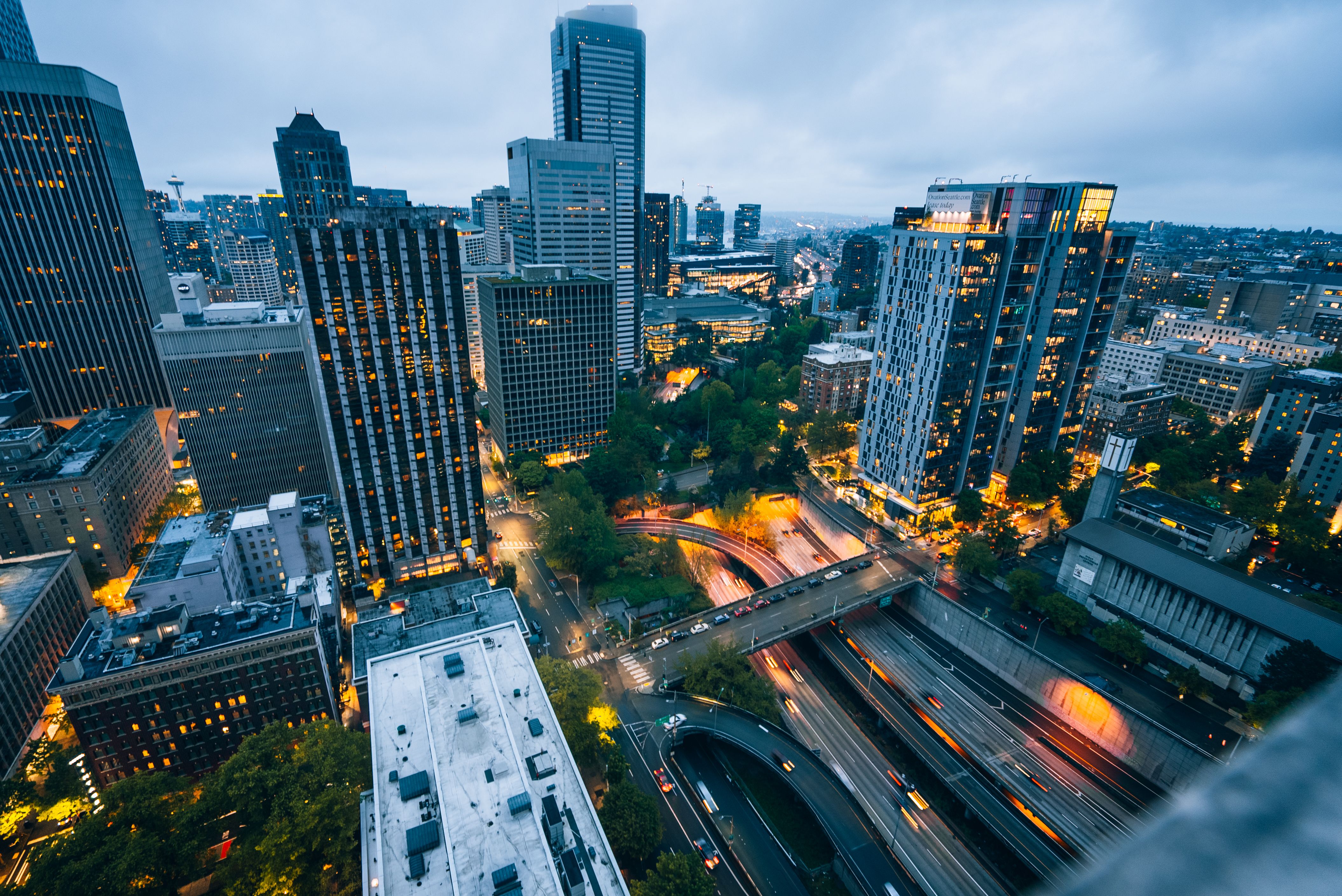 City with Modern Tall Buildings and Illuminated Streets · Free Stock Photo