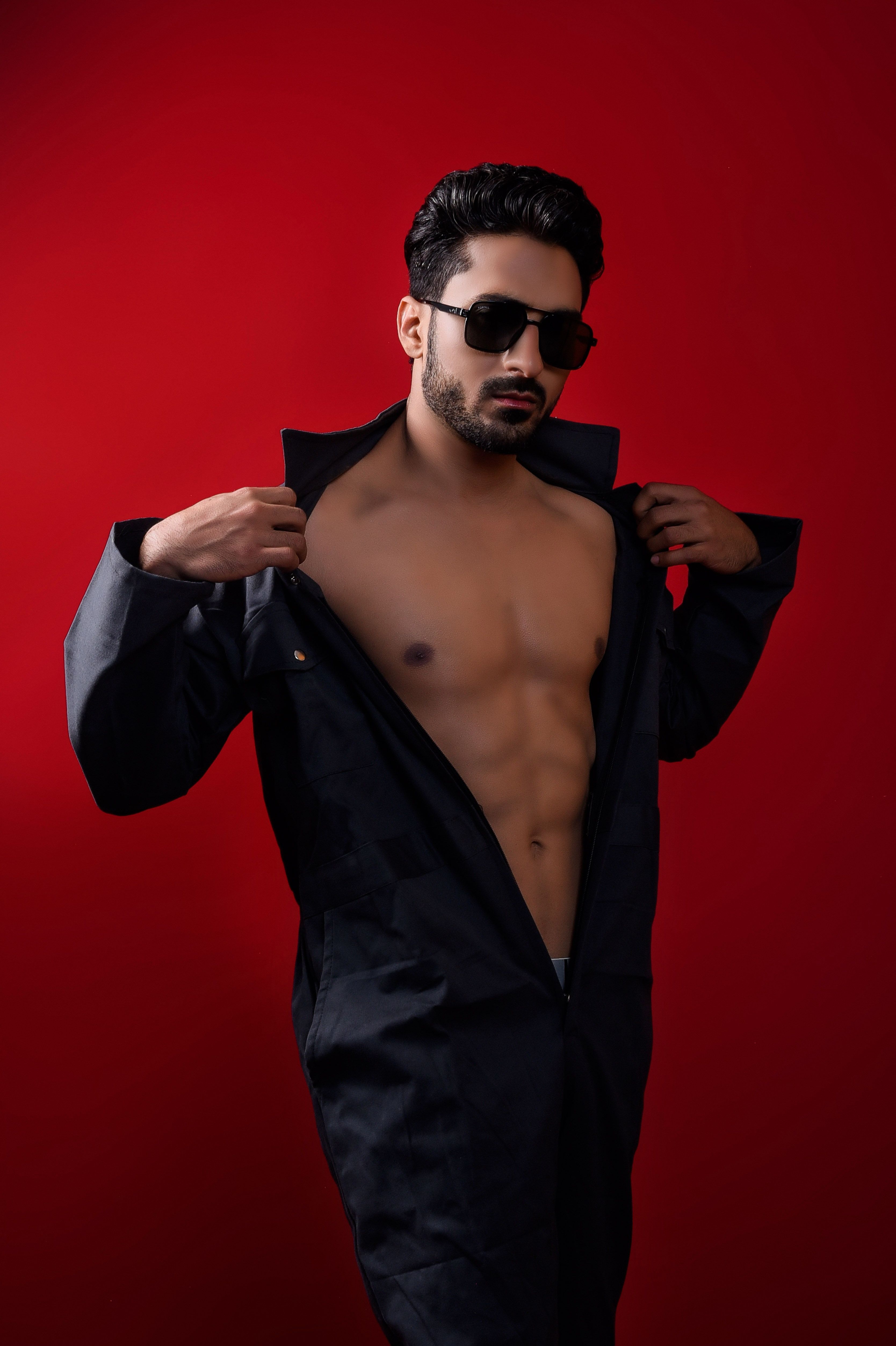 Muscular Brunette Man Taking off Uniform · Free Stock Photo