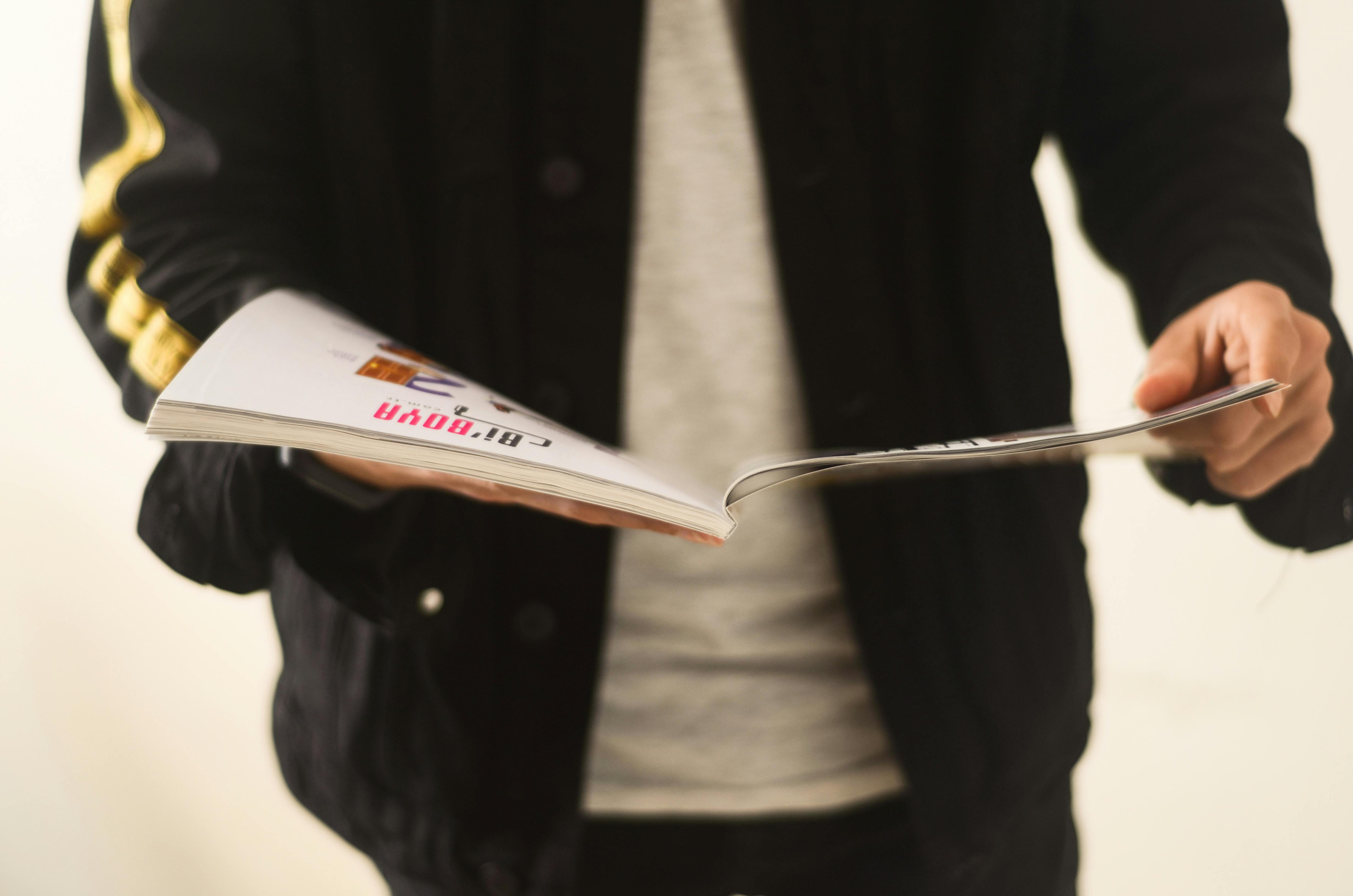 Person Reading Magazine · Free Stock Photo