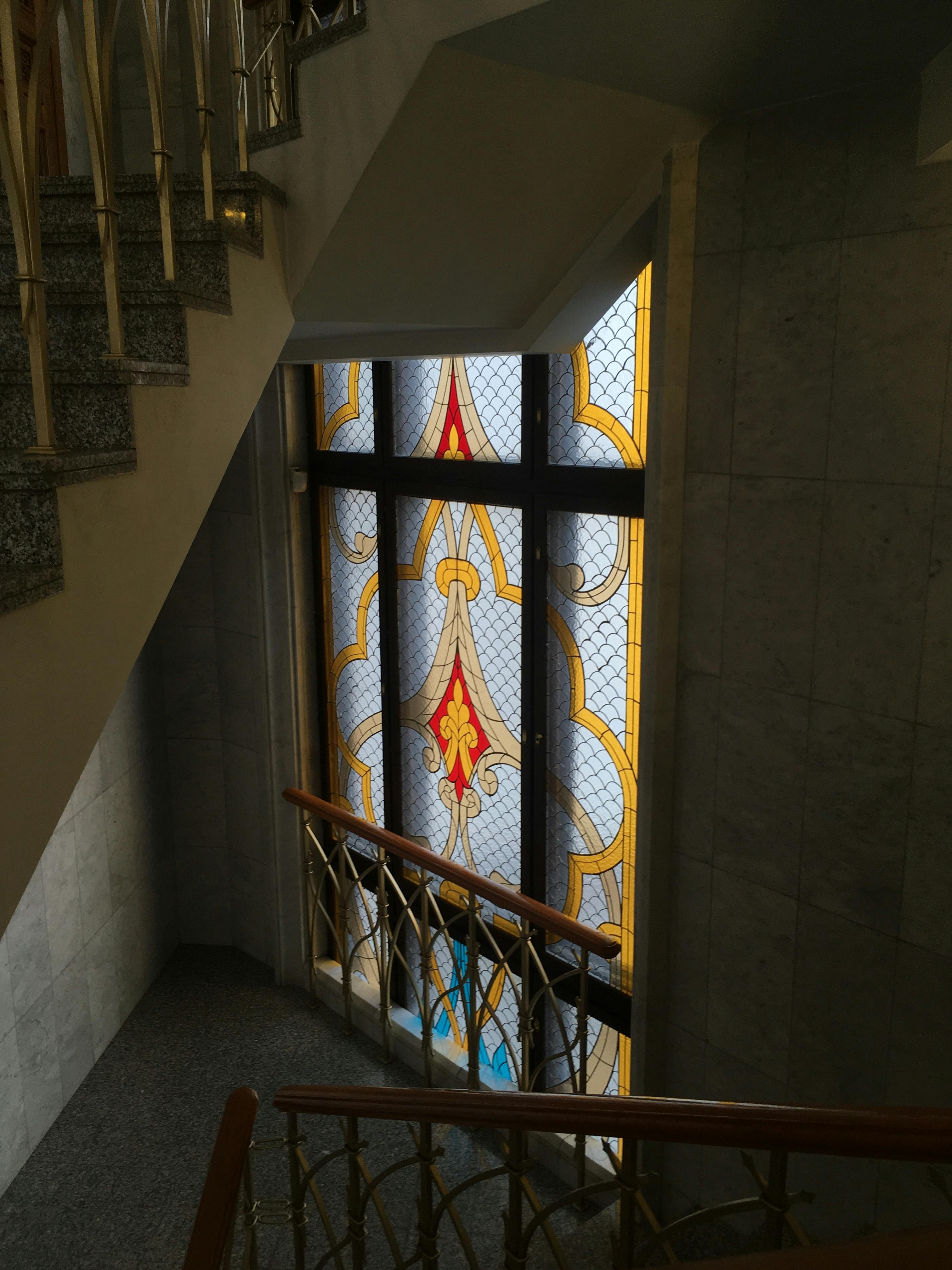 A Staircase With a Stained Glass Window · Free Stock Photo