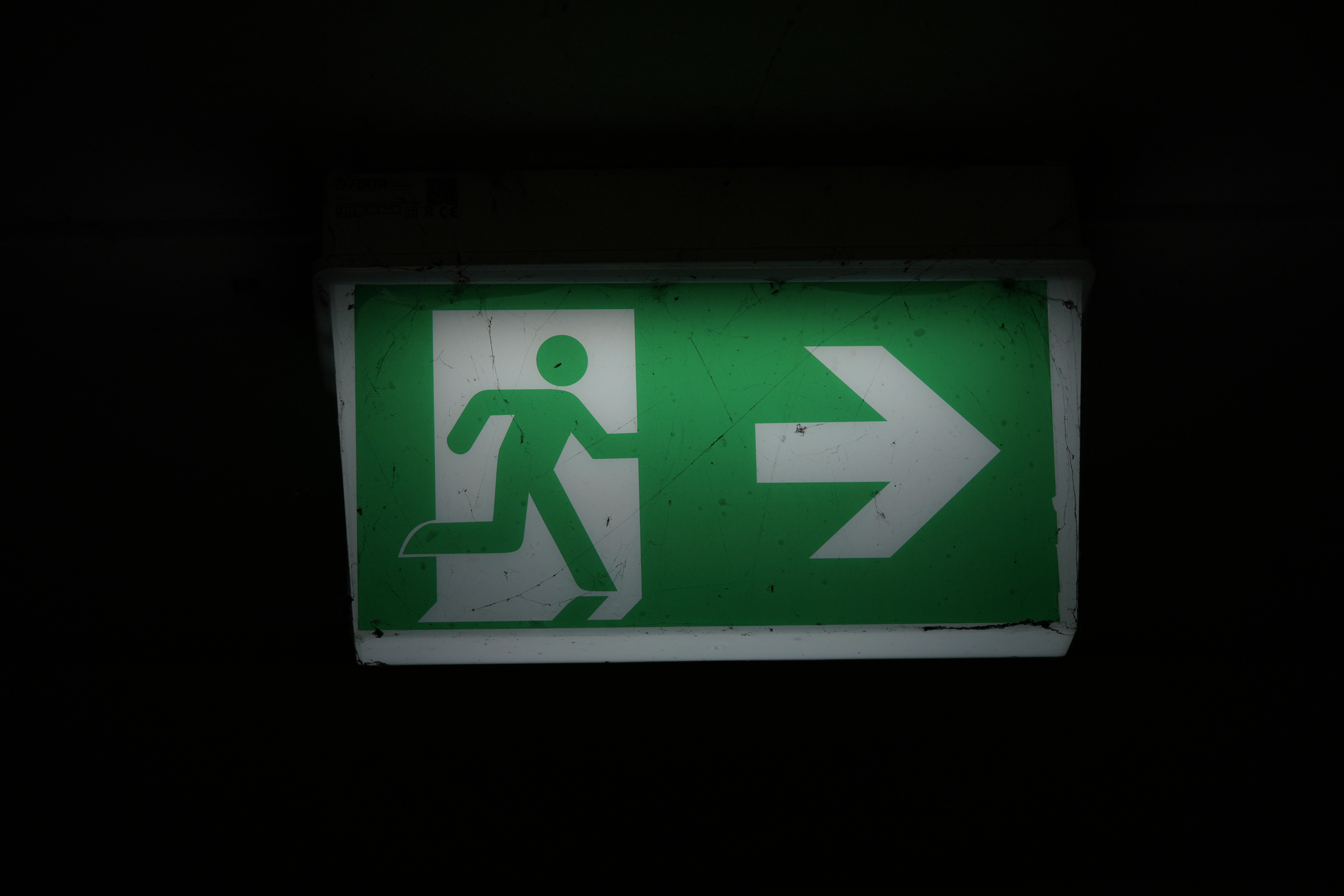 Emergency Exit Direction Sign · Free Stock Photo