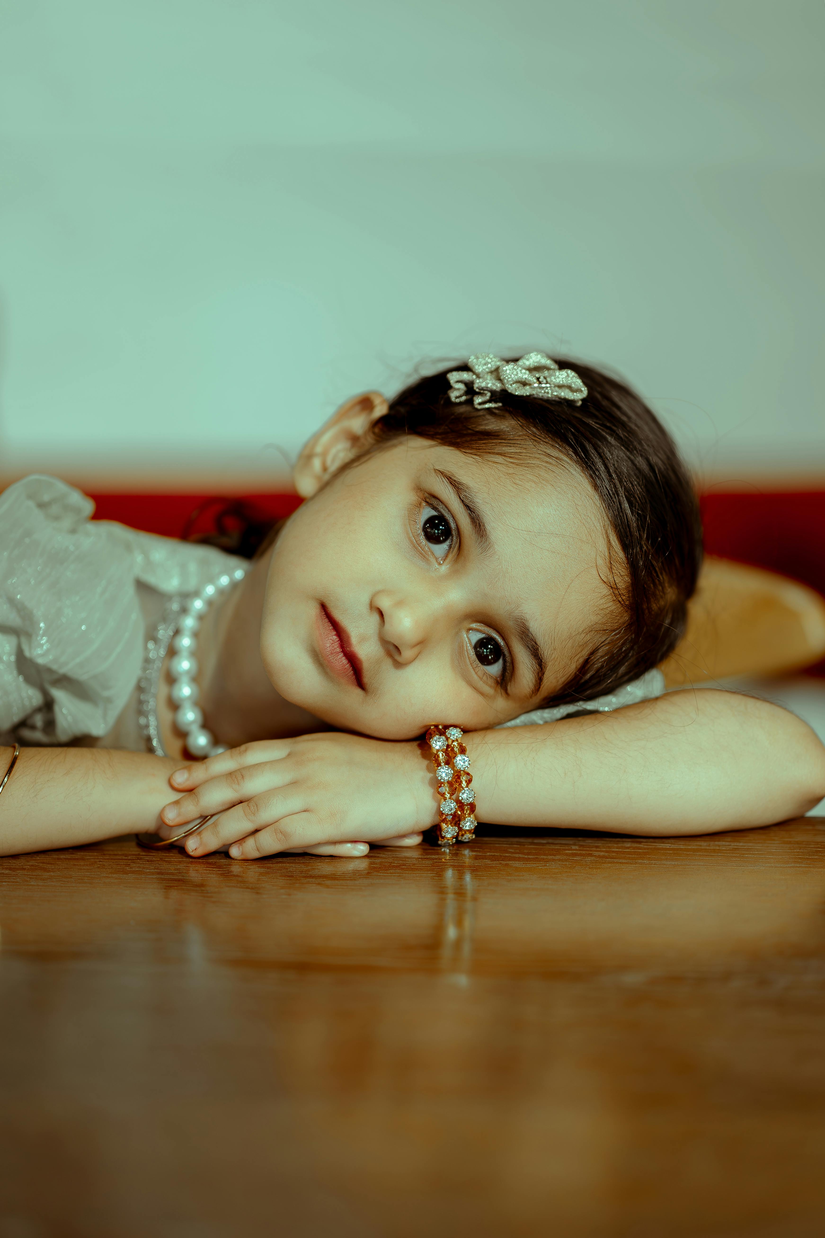 Portrait of Brunette Girl Wearing Pearls · Free Stock Photo