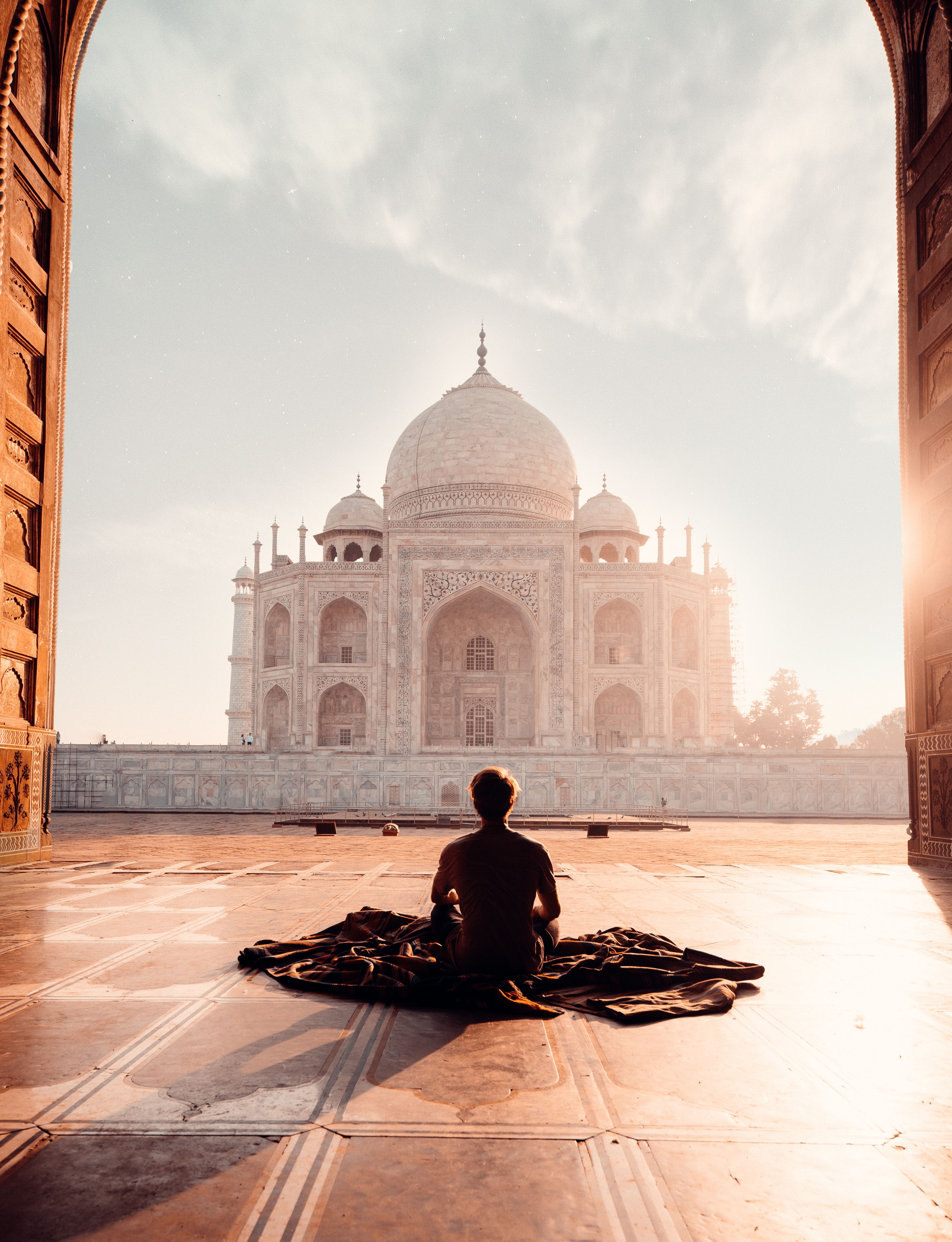 Person Sitting in Front of the Taj Mahal · Free Stock Photo