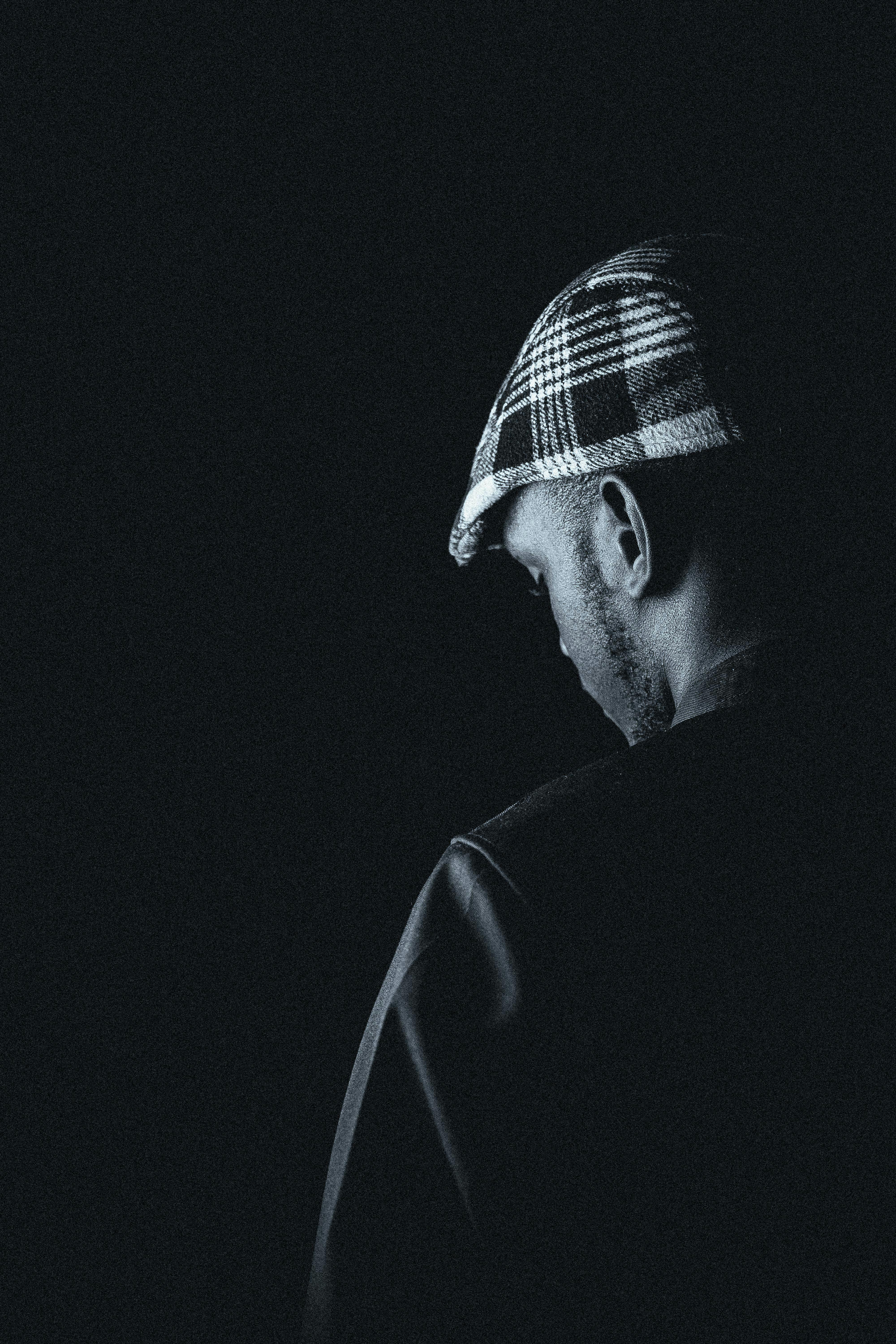 Portrait of African Man in Shadow in Black and White · Free Stock Photo