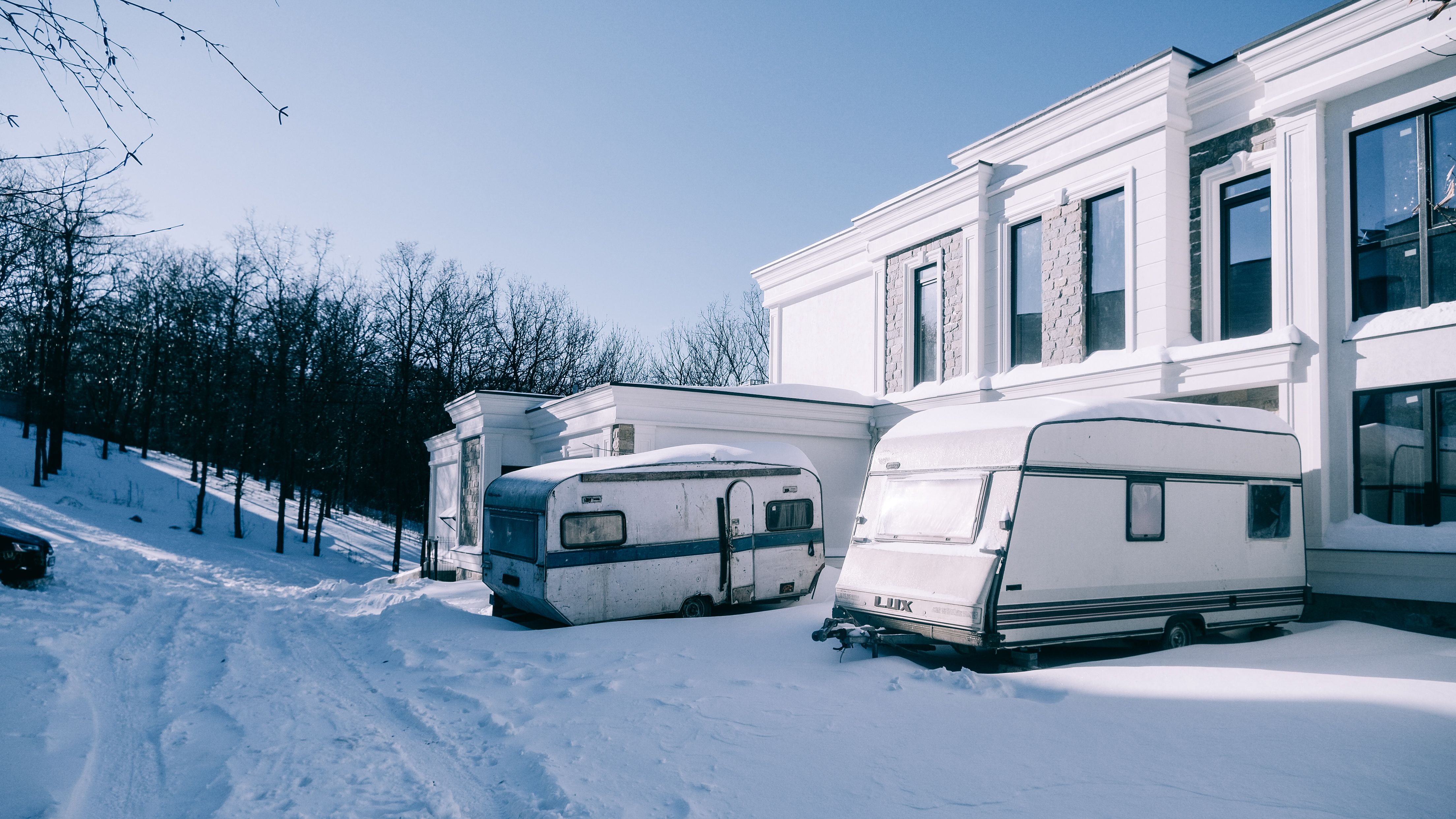 View of Trailers Parked in Front of a Building in a Forest · Free Stock ...