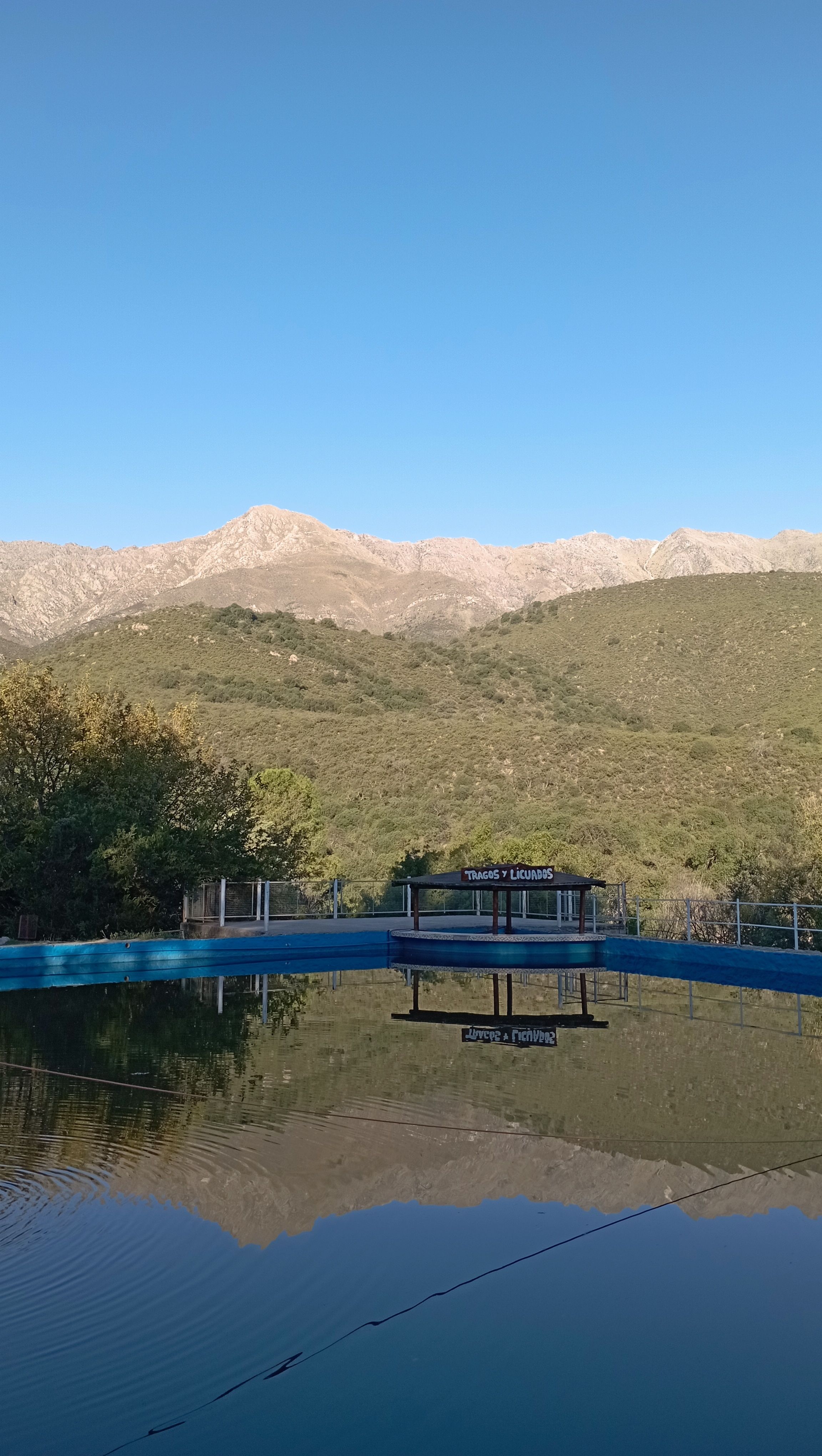 Outdoor Swimming Pool and Mountains in the Distance · Free Stock Photo