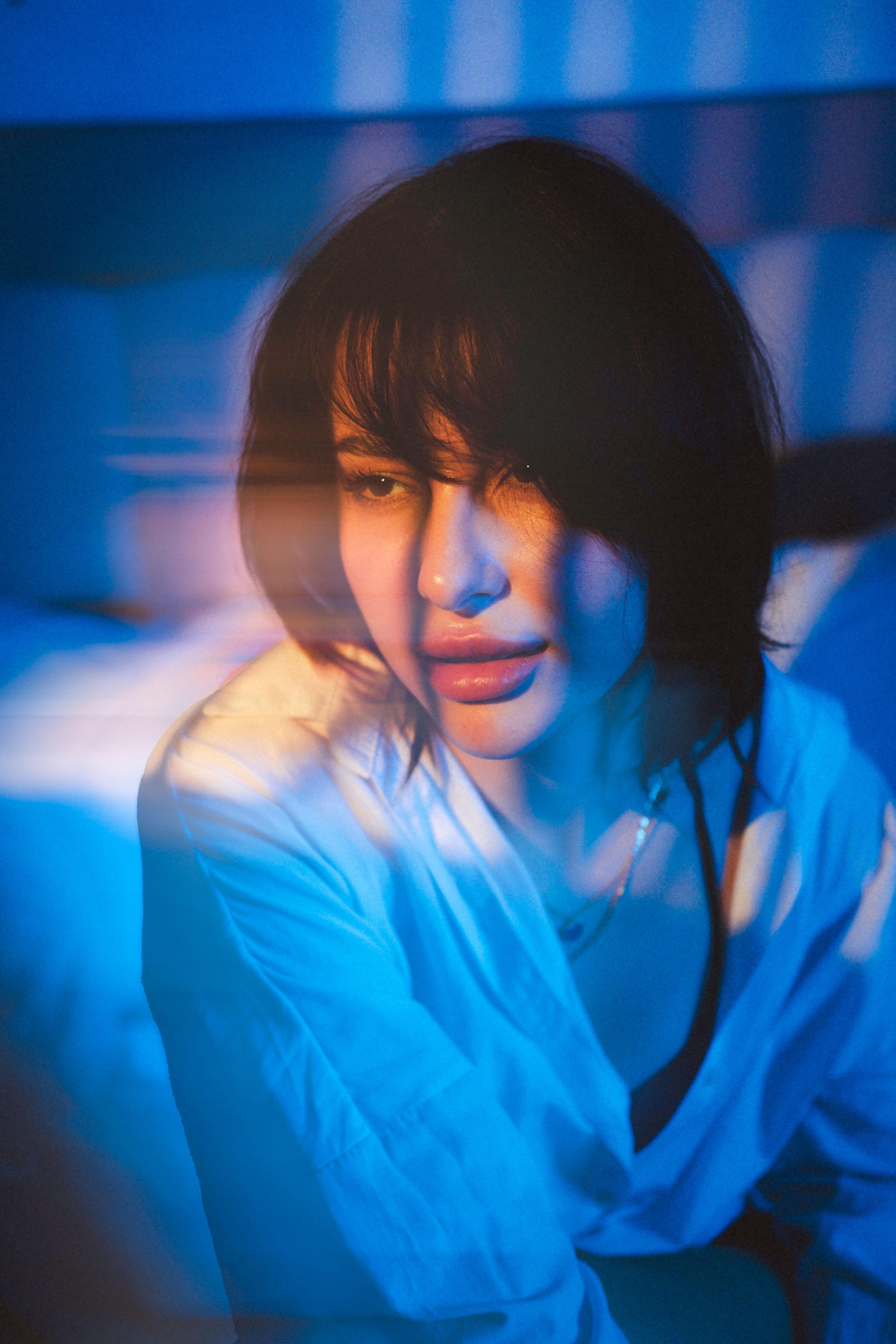 Young Woman in Blue Lighting · Free Stock Photo