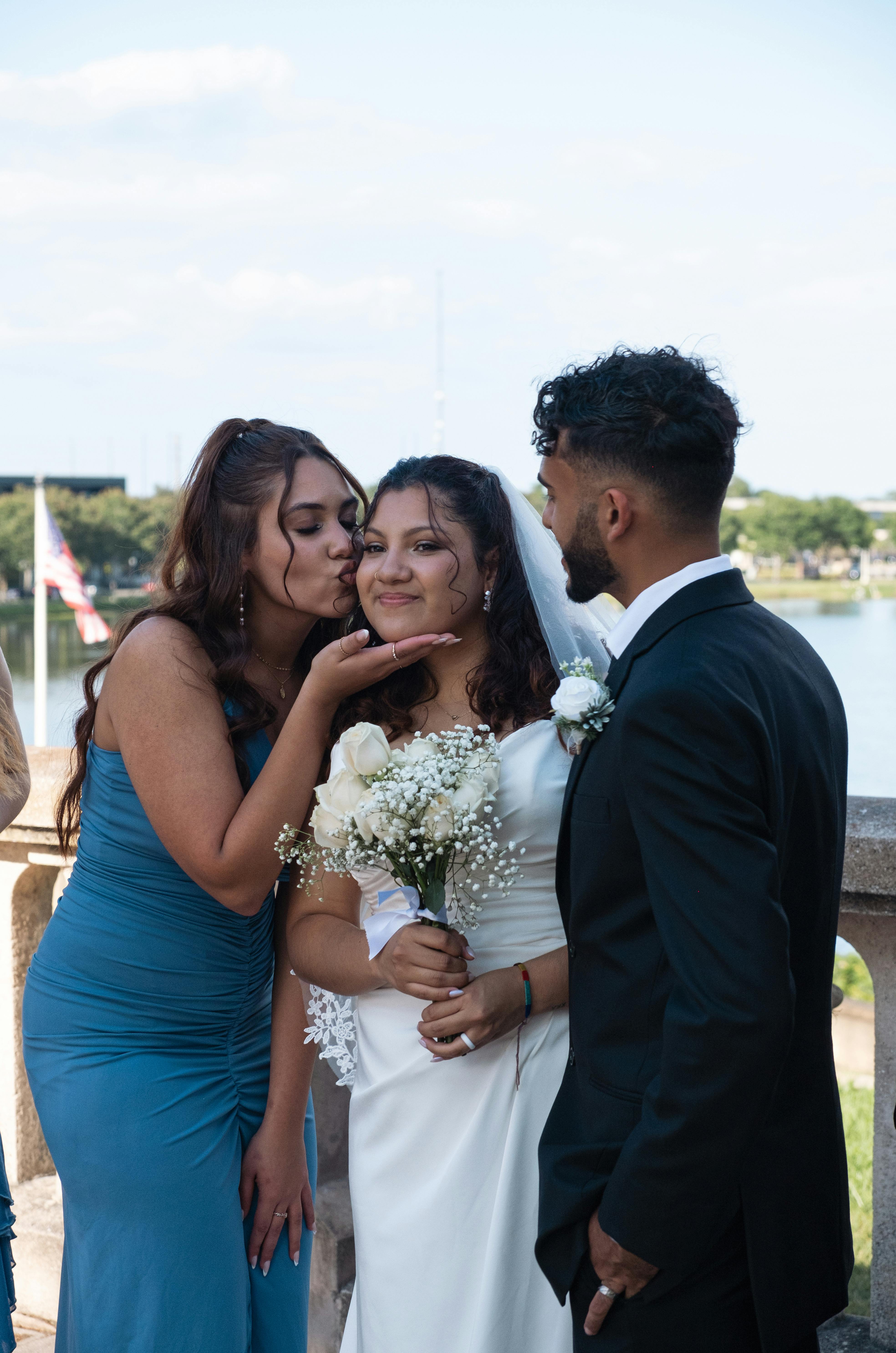 Bridesmaid Kissing the Bride on the Cheek · Free Stock Photo