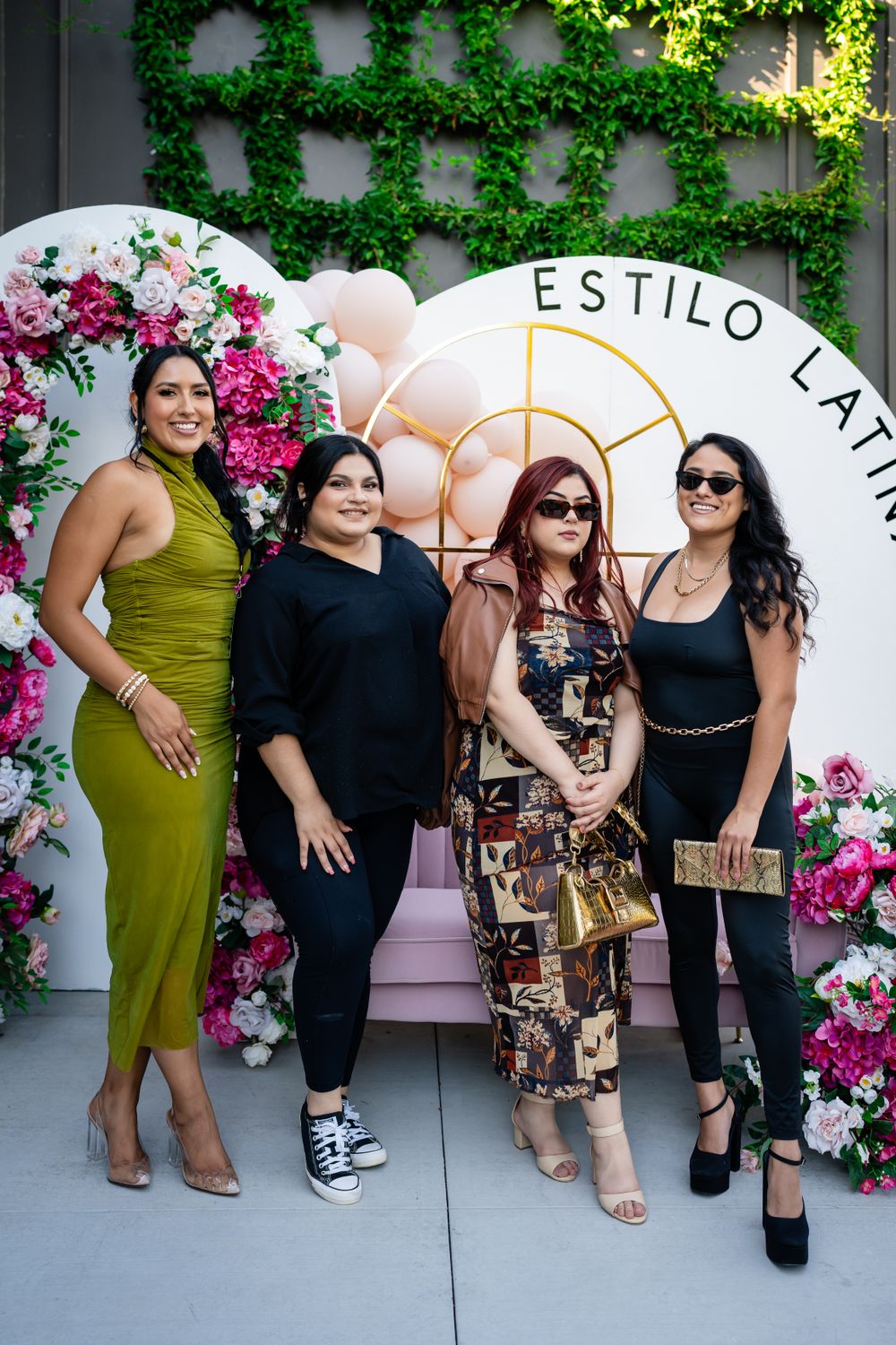 Portrait Of Elegant Women Posing In Front Of A Wall Decorated With Portrait Of Elegant Women Posing In Front Of A Wall Decorated With