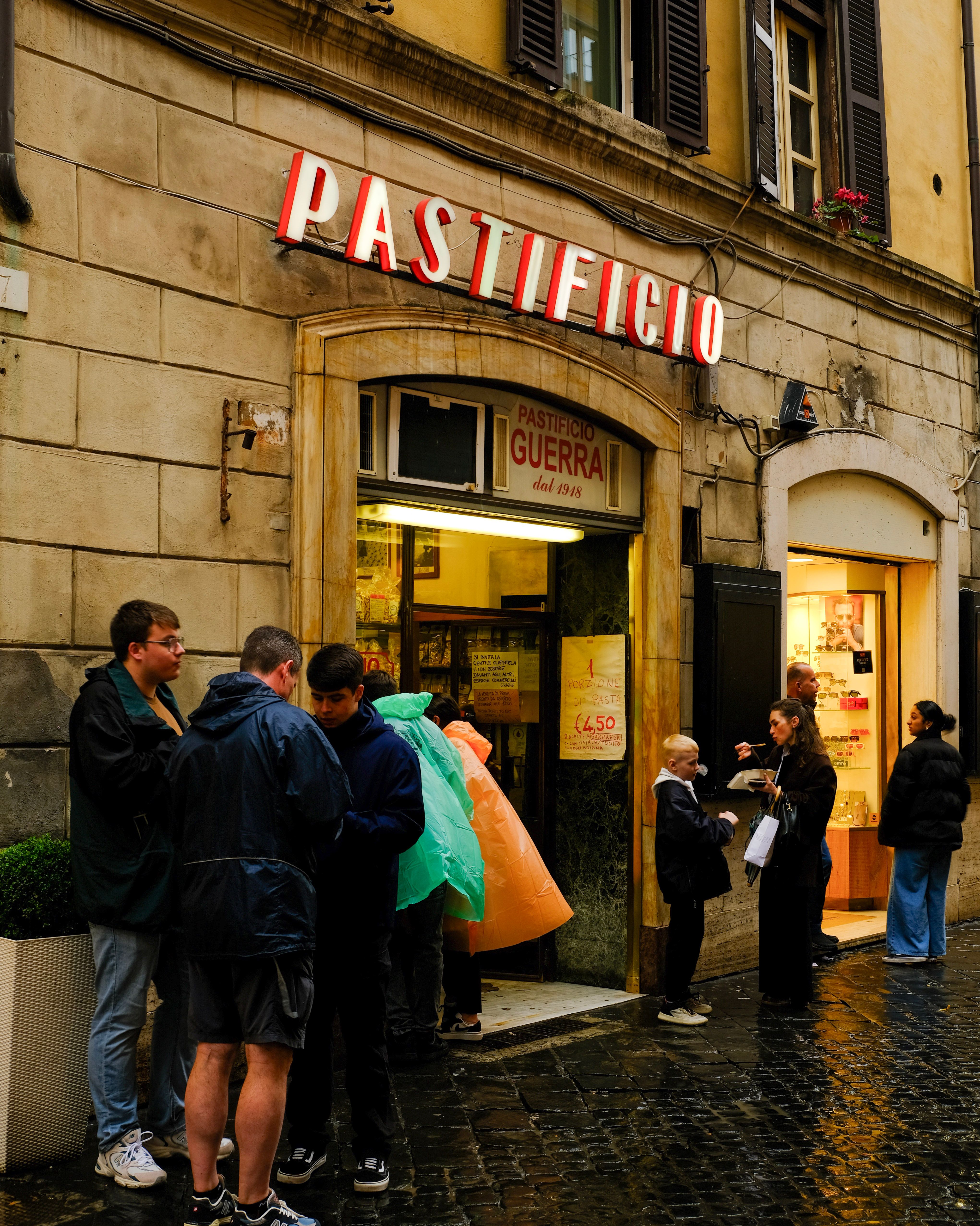 People Standing in front of a Restaurant · Free Stock Photo