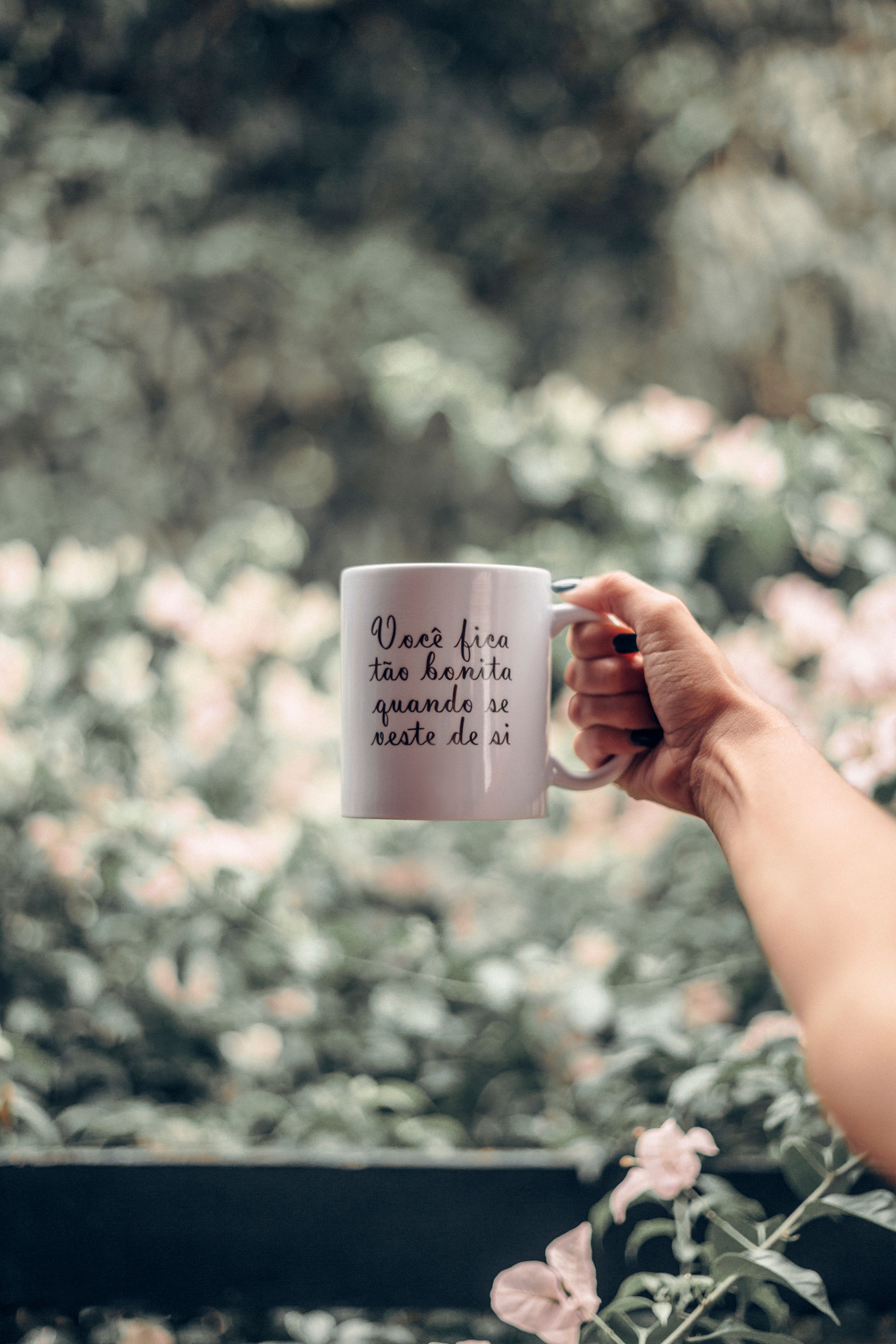 Close-up of a Woman Holding a Mug Outside · Free Stock Photo