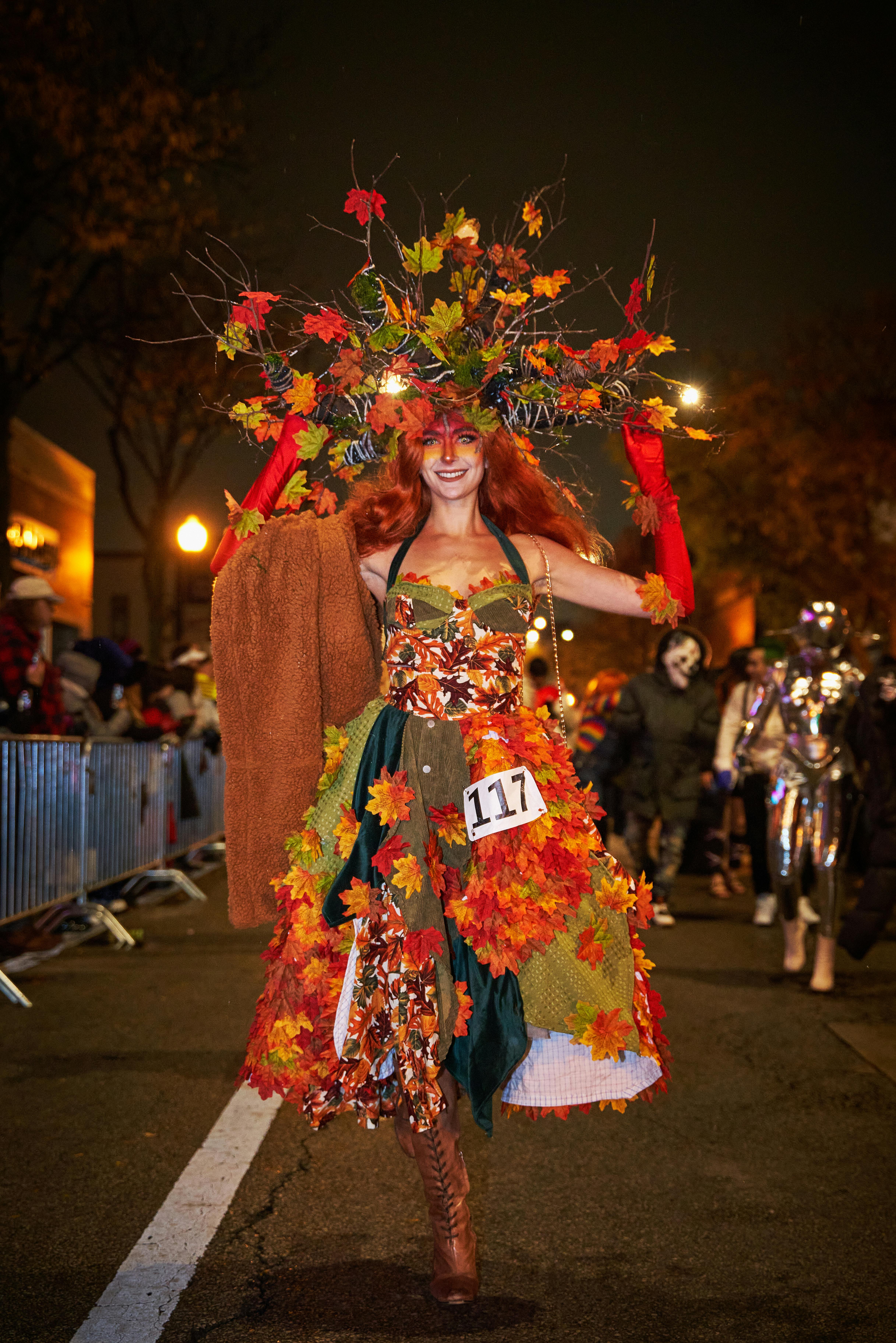 A Young Woman Wearing a Costume with Autumnal Leaves Walking in a ...