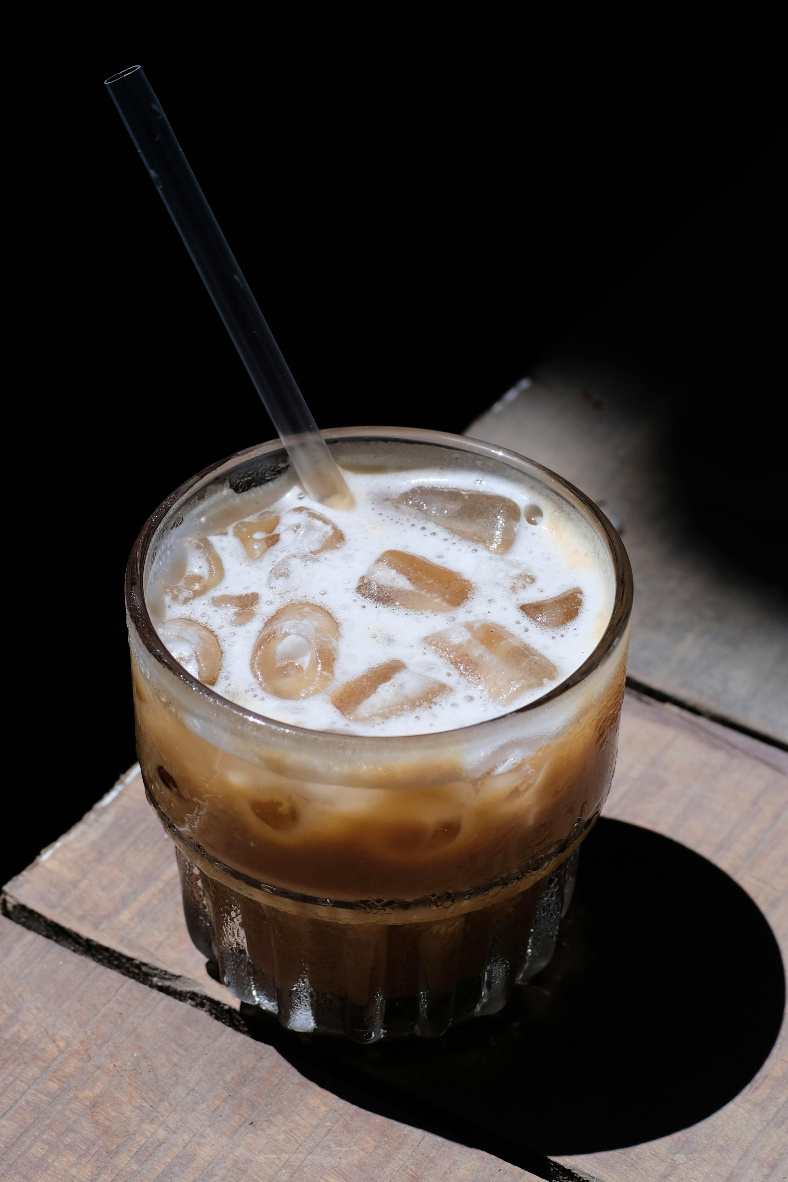 A Glass of Ice Coffee on a Wooden Table · Free Stock Photo