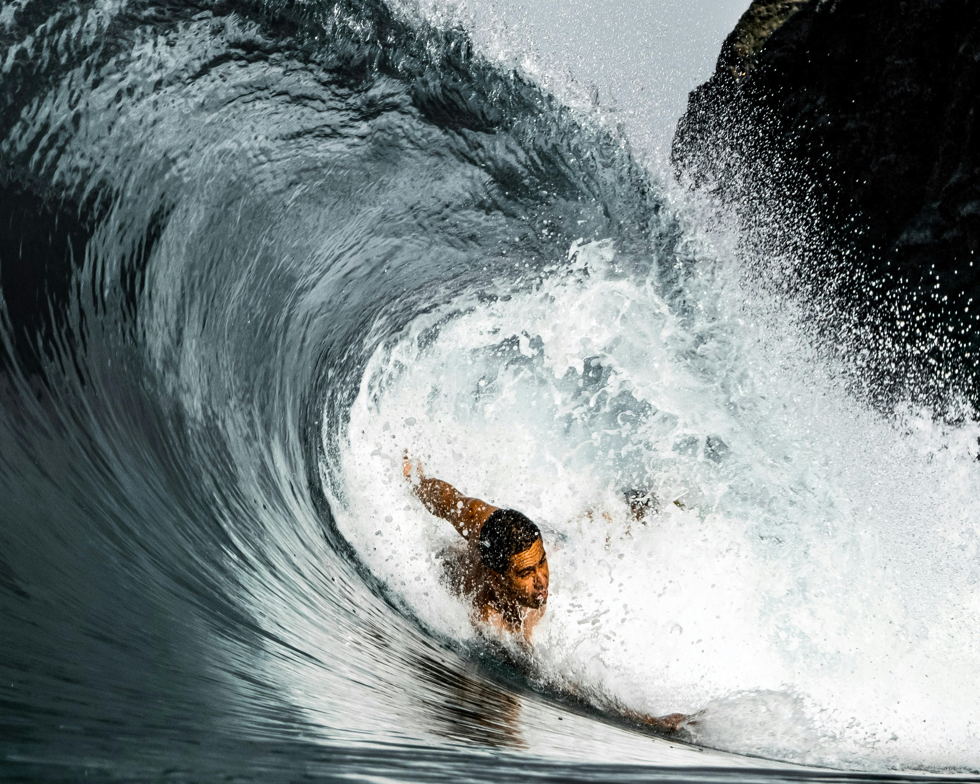 Man Falling off Surfing Board inside Large Curvy Wave · Free Stock Photo