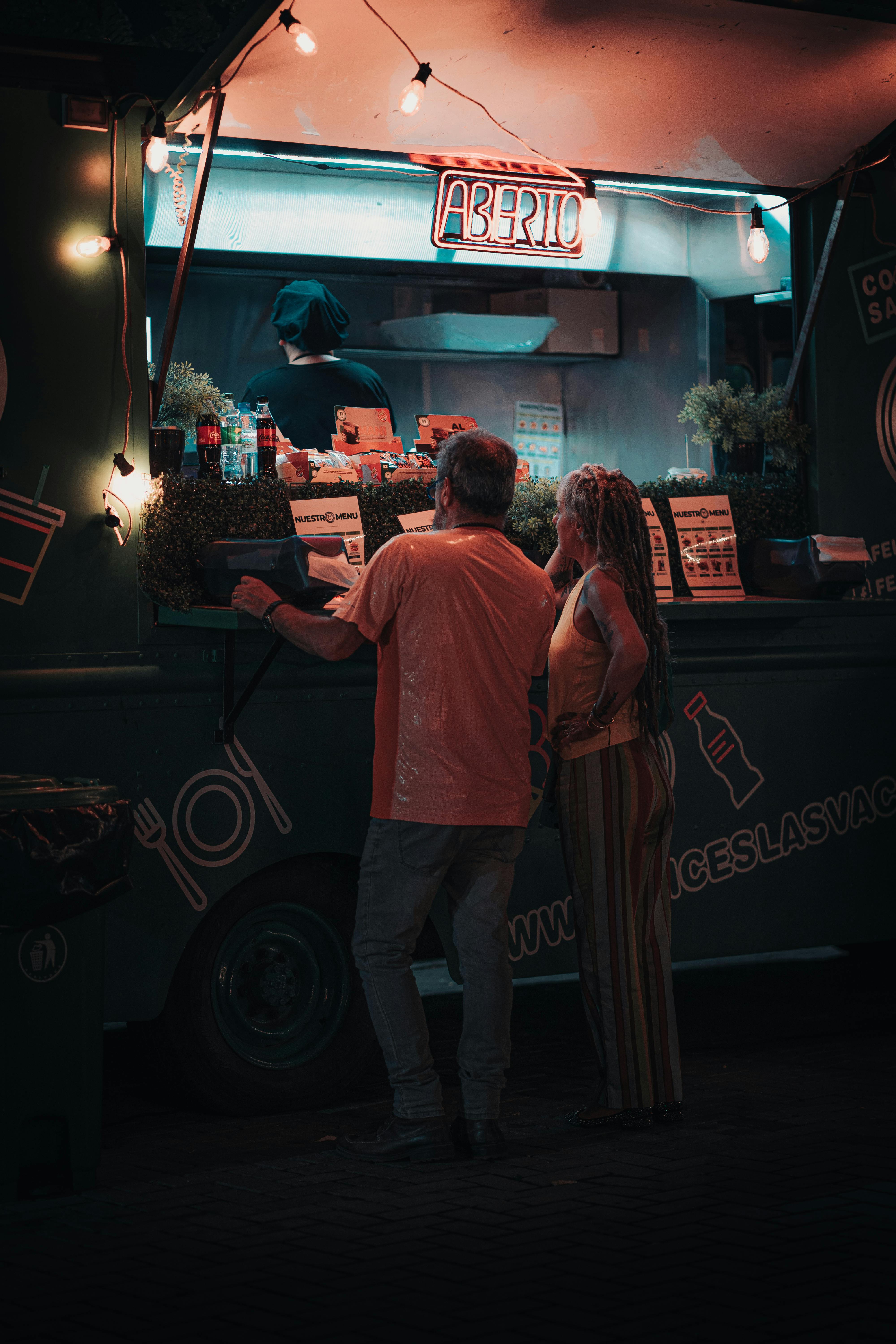 People Getting Food at Food Truck in the Evening · Free Stock Photo