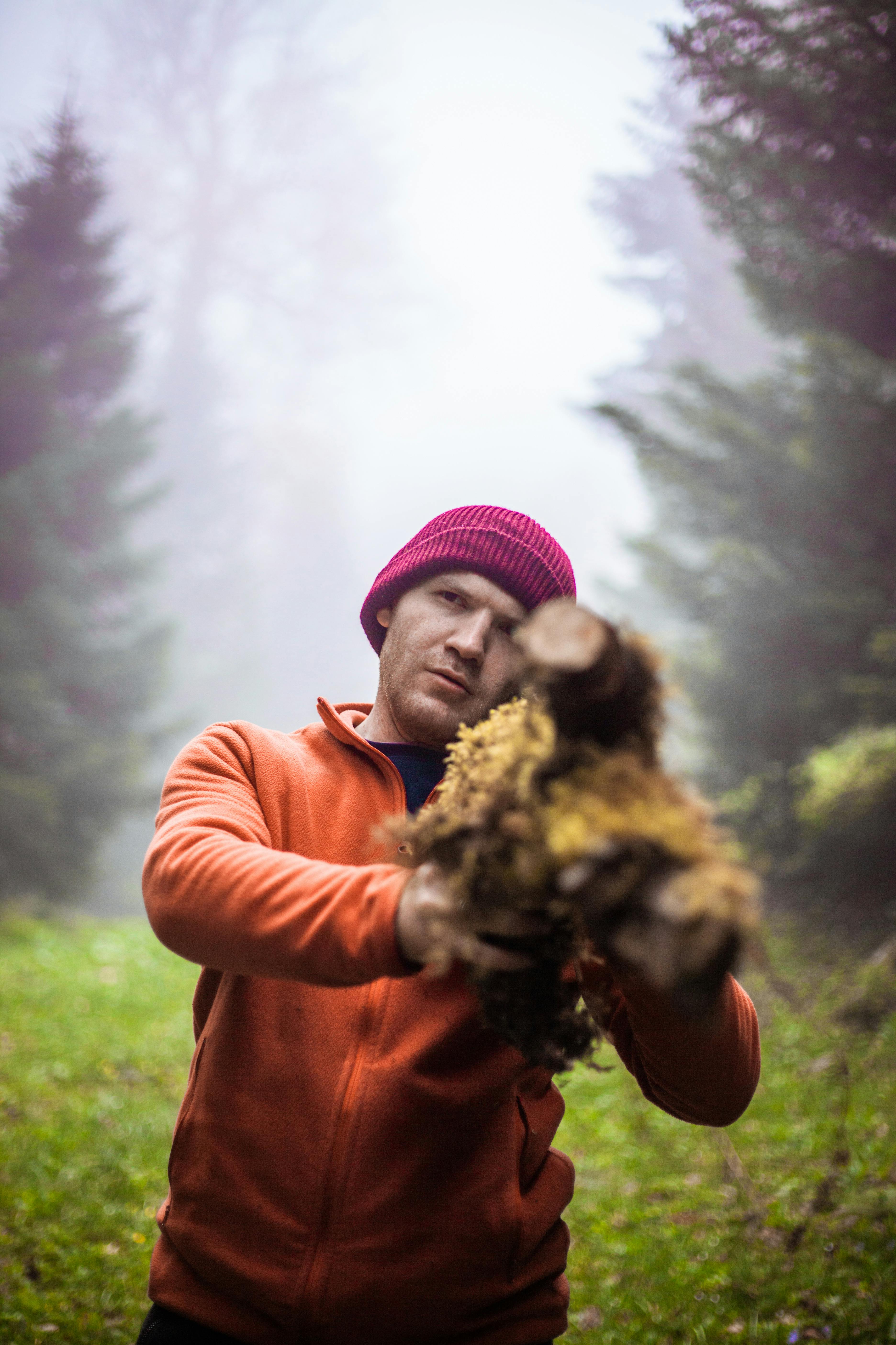 A Man Holding a Log · Free Stock Photo