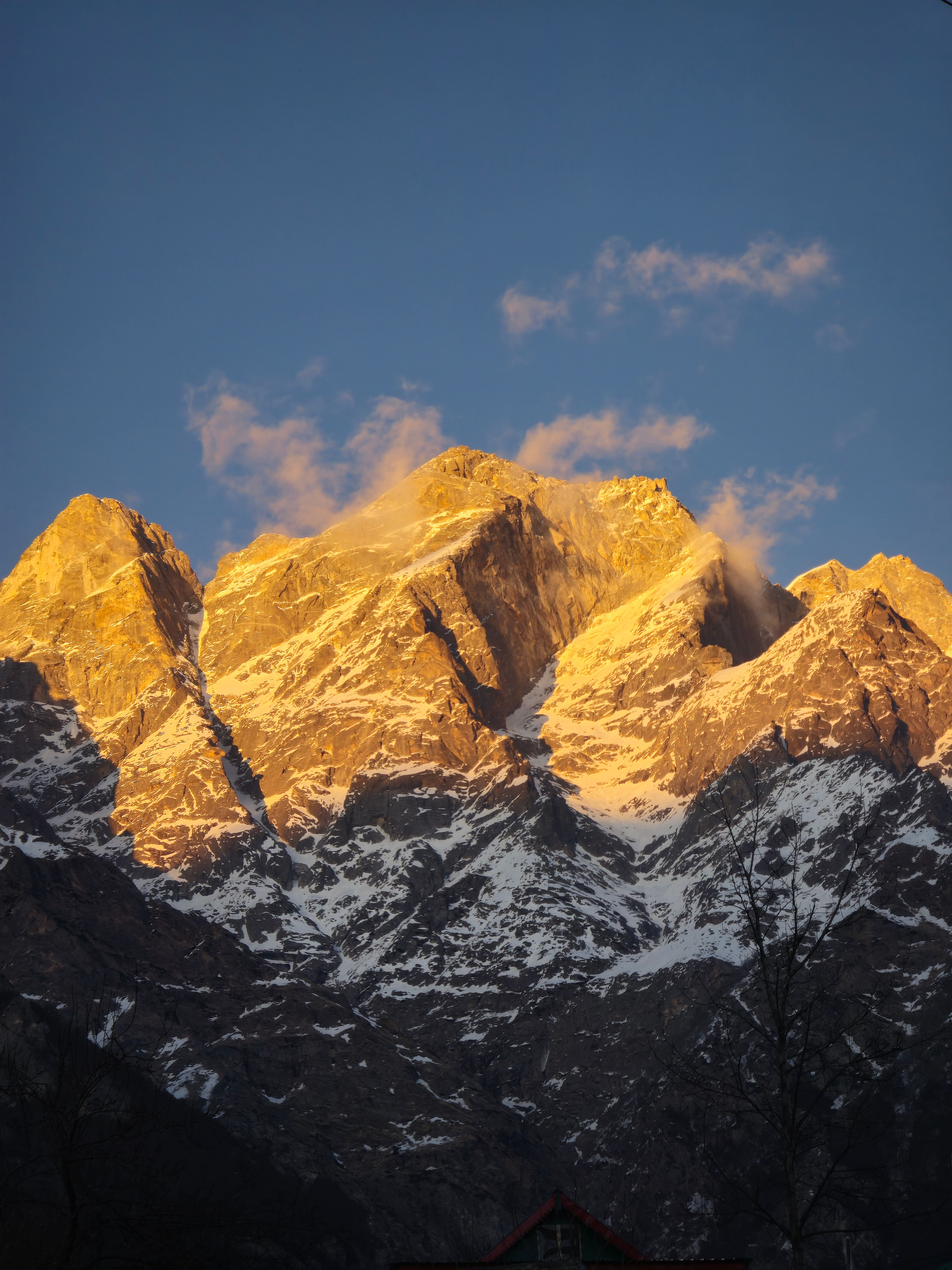 Sunlight Illuminating Mountain Peaks under Blue Sky · Free Stock Photo