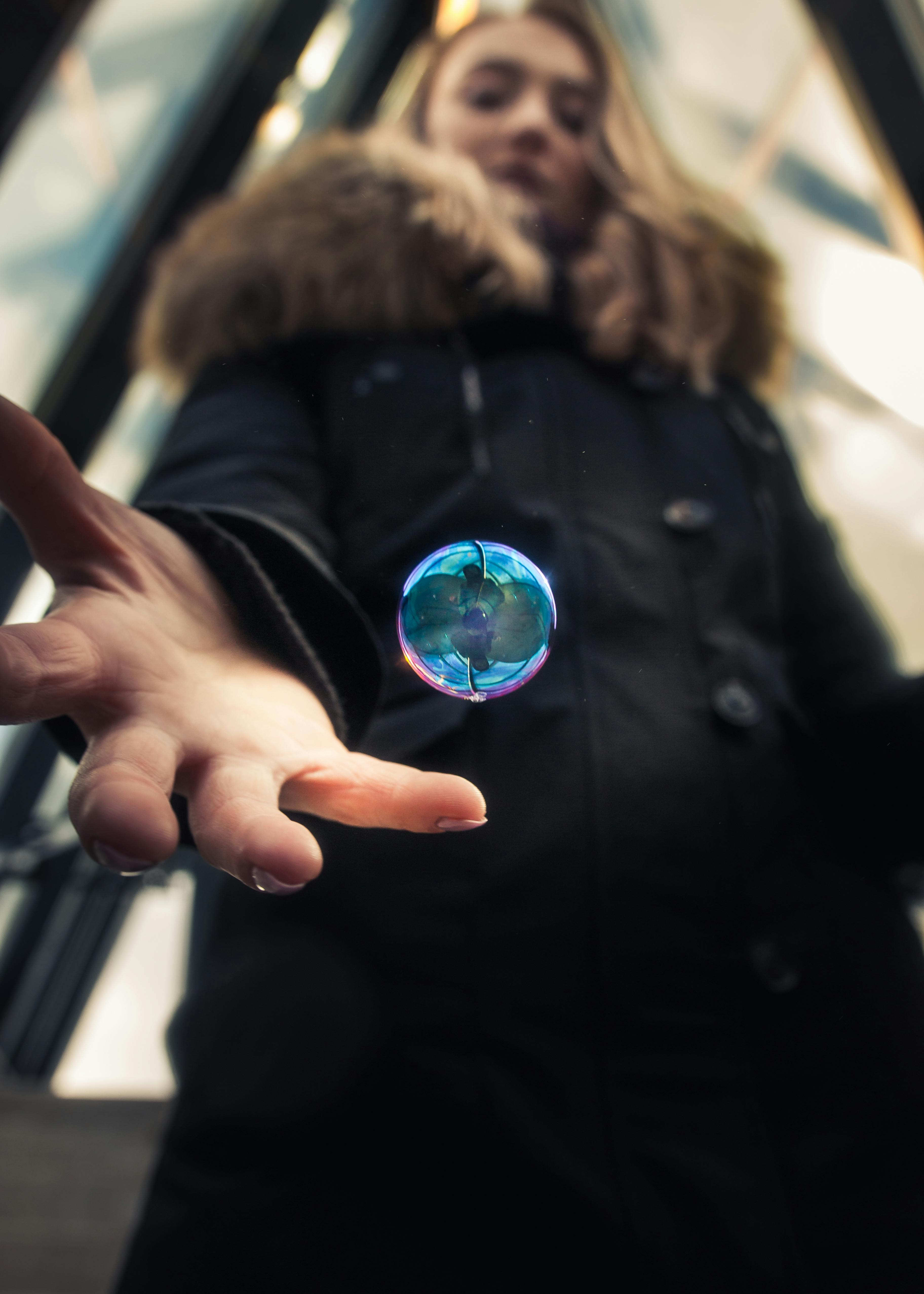 Floating Ball Near Person Hand · Free Stock Photo