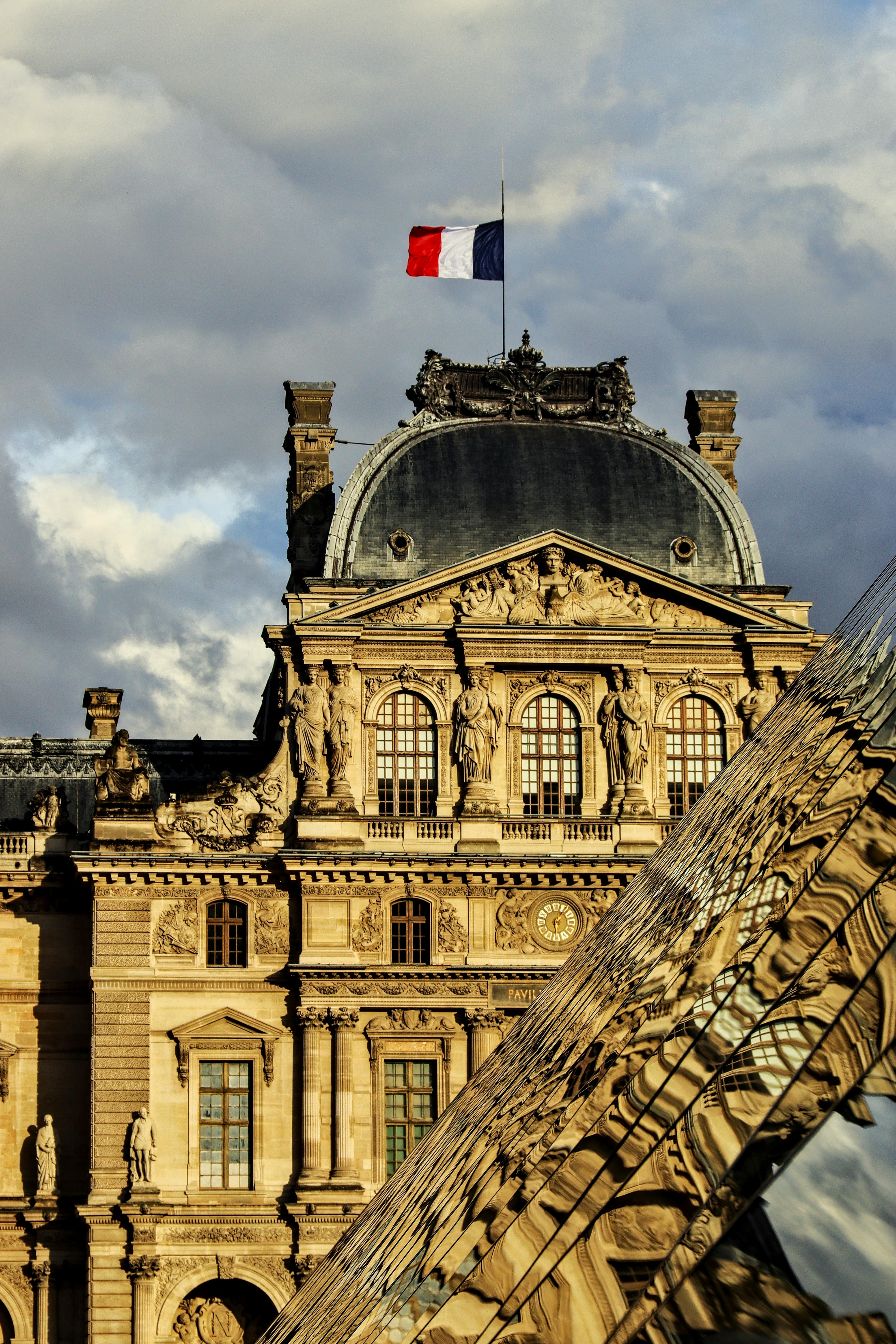 French Flag on the Roof of the Louvre Palace · Free Stock Photo