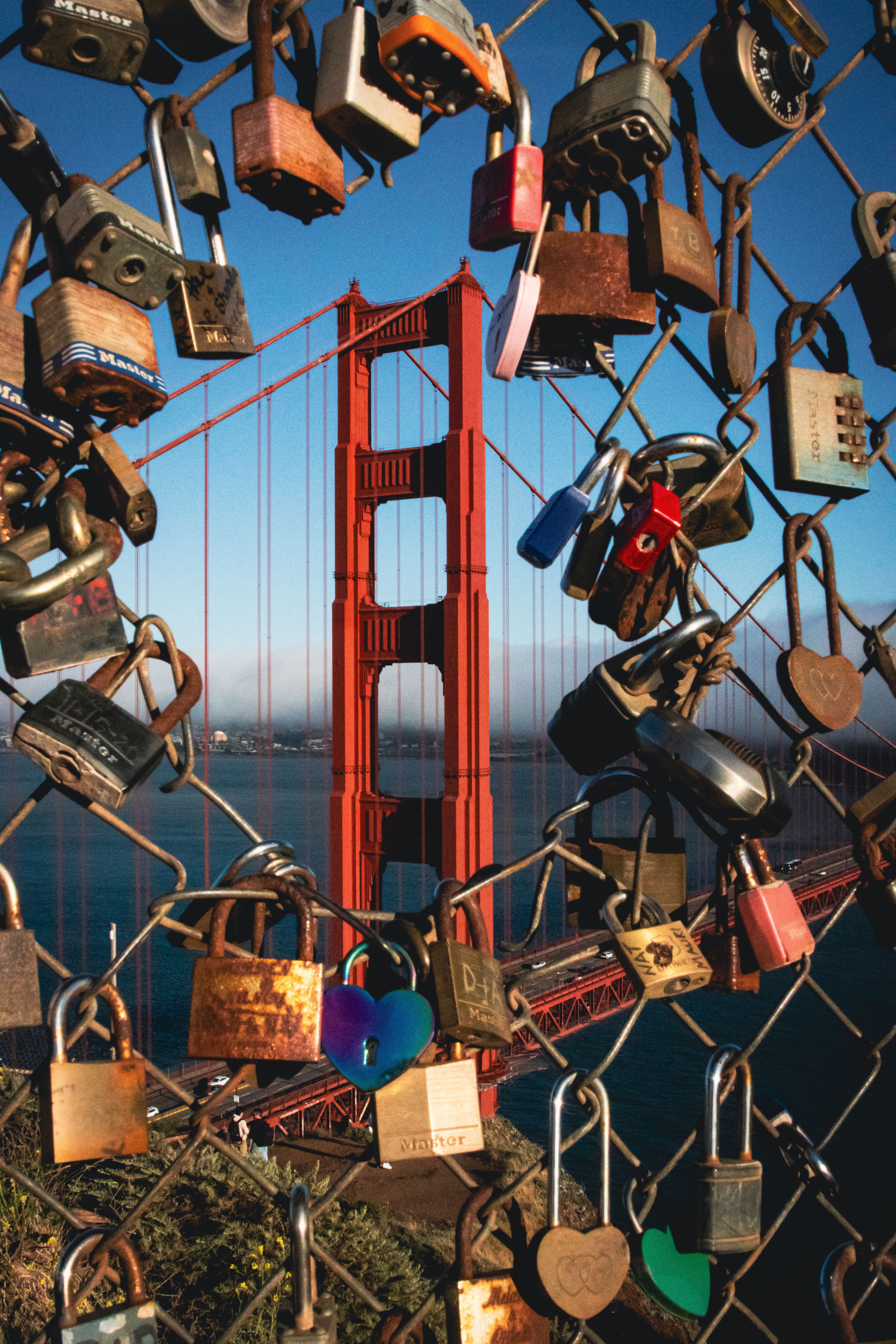 View of the Golden Gate Bridge from behind a Fence with Love Locks ...
