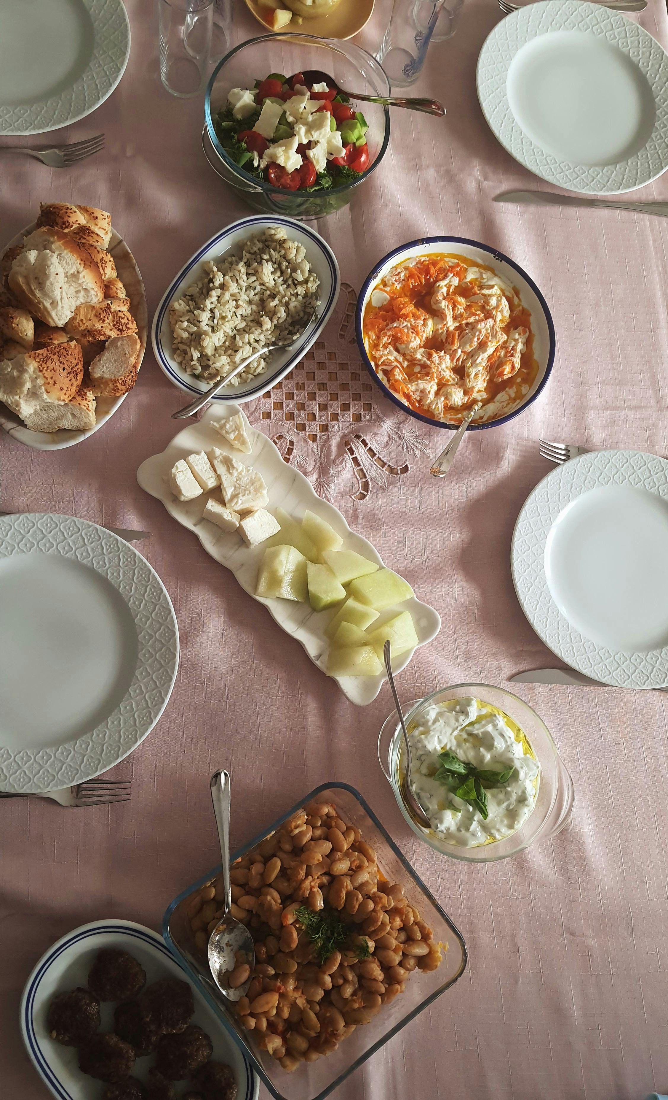 Top View of Table with Plates and Homemade Dishes · Free Stock Photo