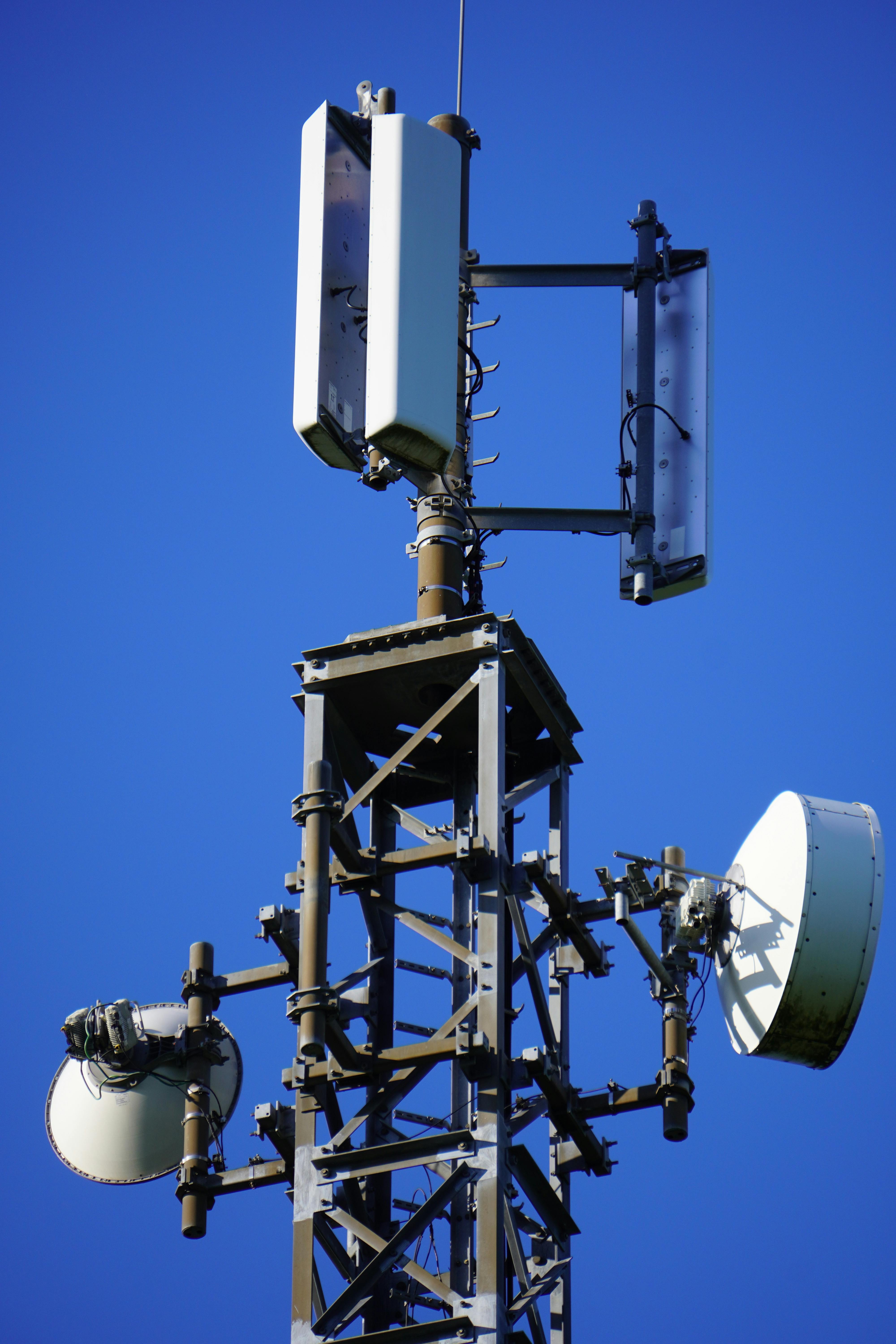 A cell phone tower with two antennas on top · Free Stock Photo