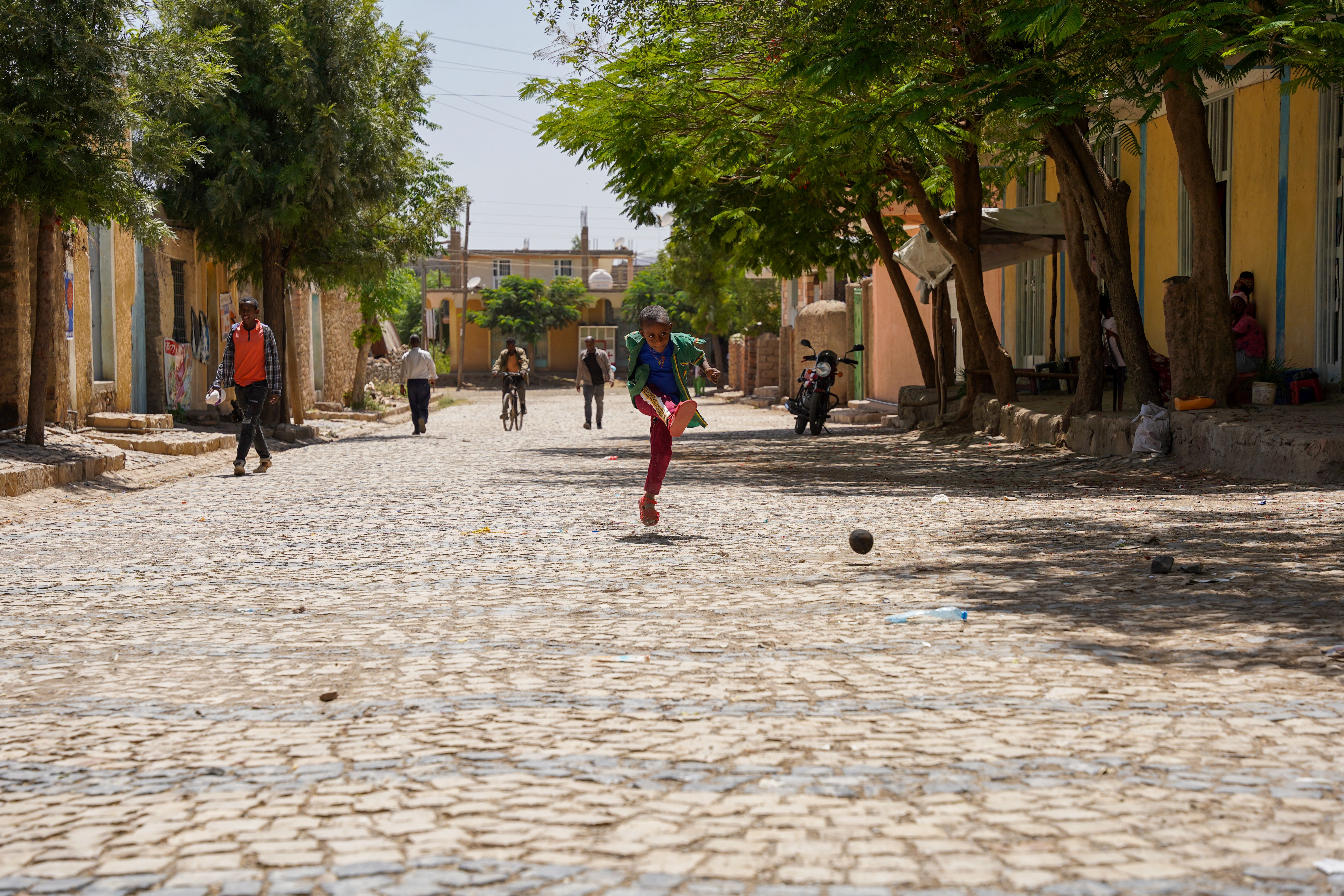 Boy Playing Ball on Street · Free Stock Photo