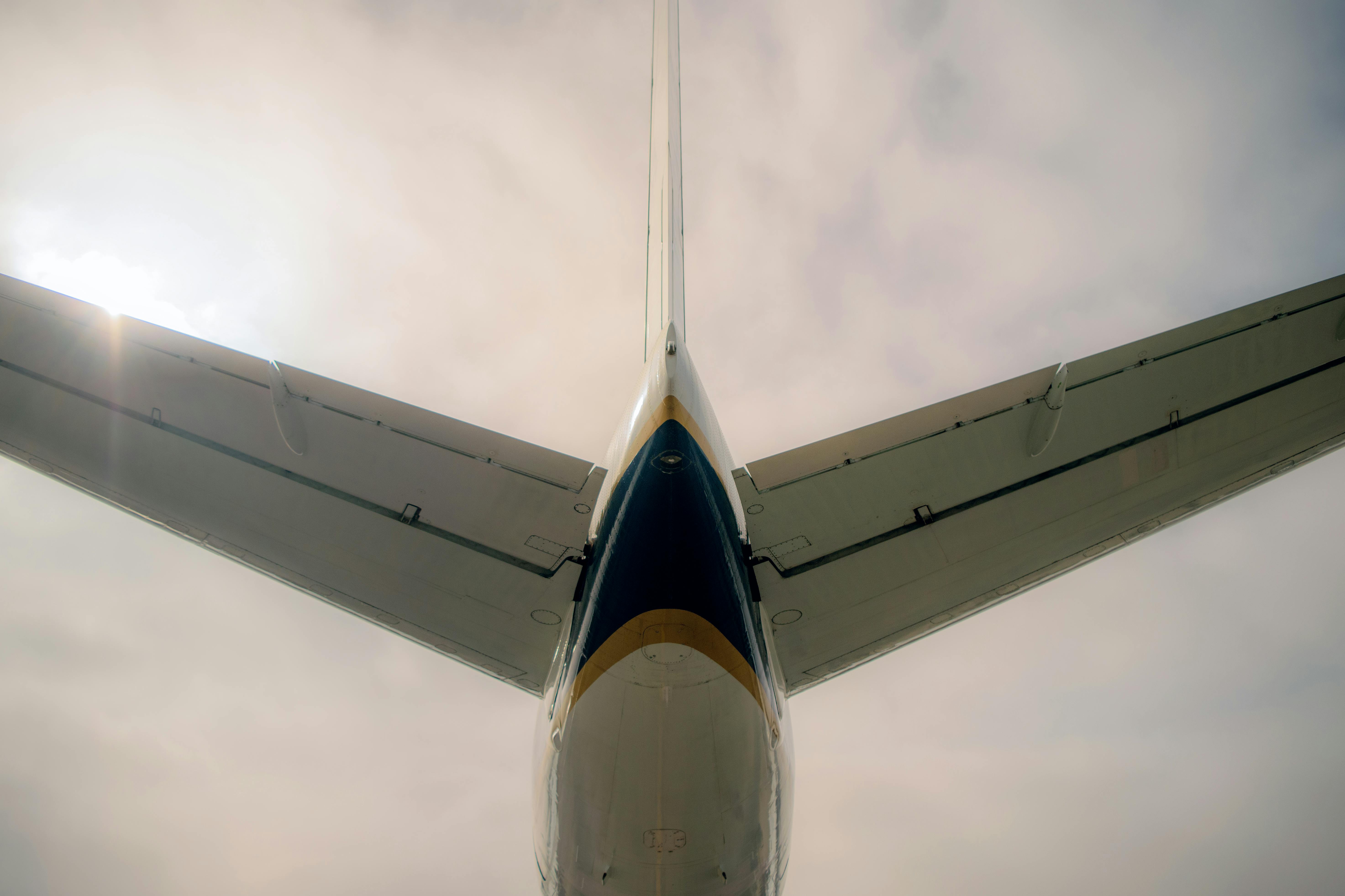 Low Angle Shot of Airplane Wings · Free Stock Photo