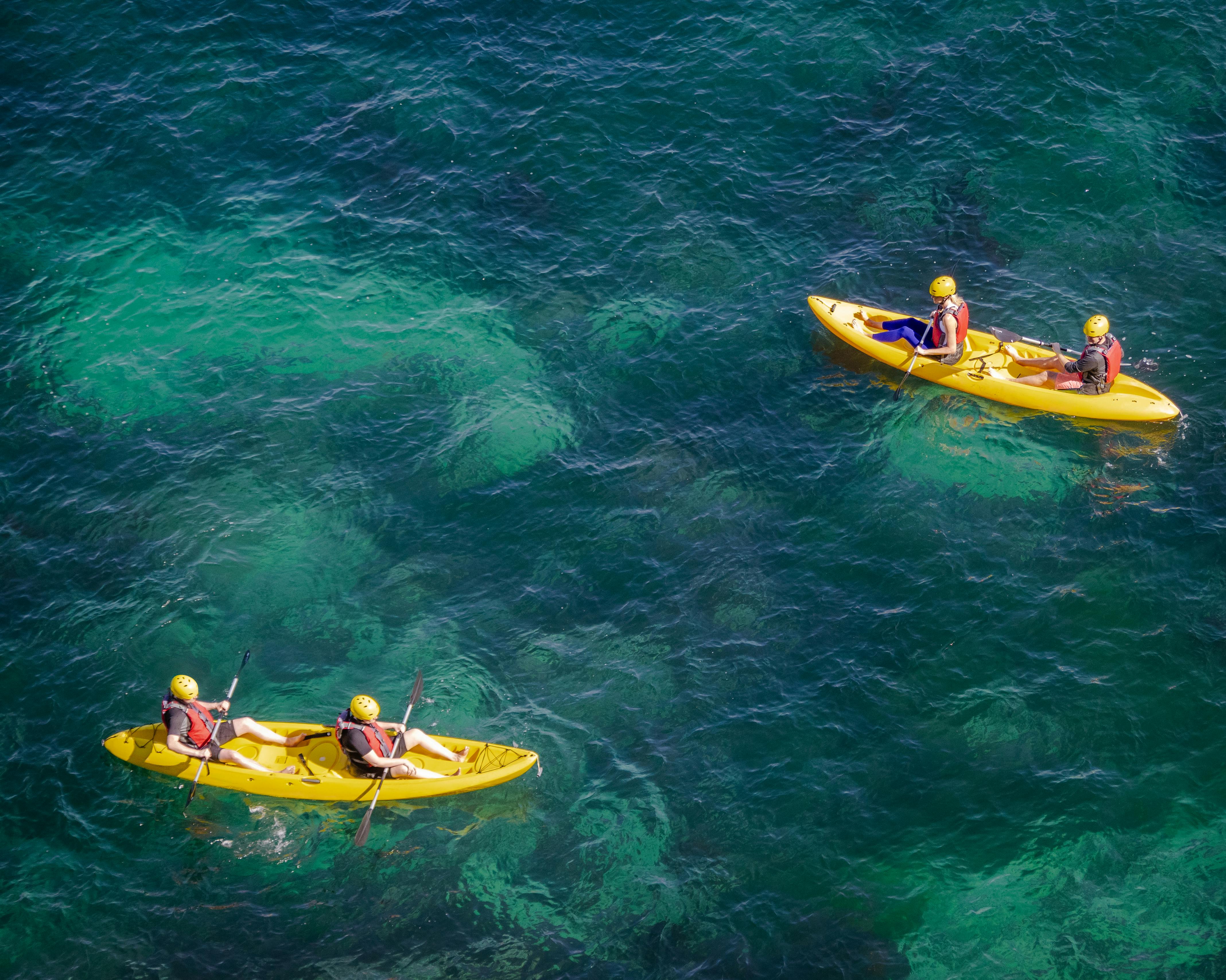 Aerial View of People Kayaking on Turquoise Water · Free Stock Photo
