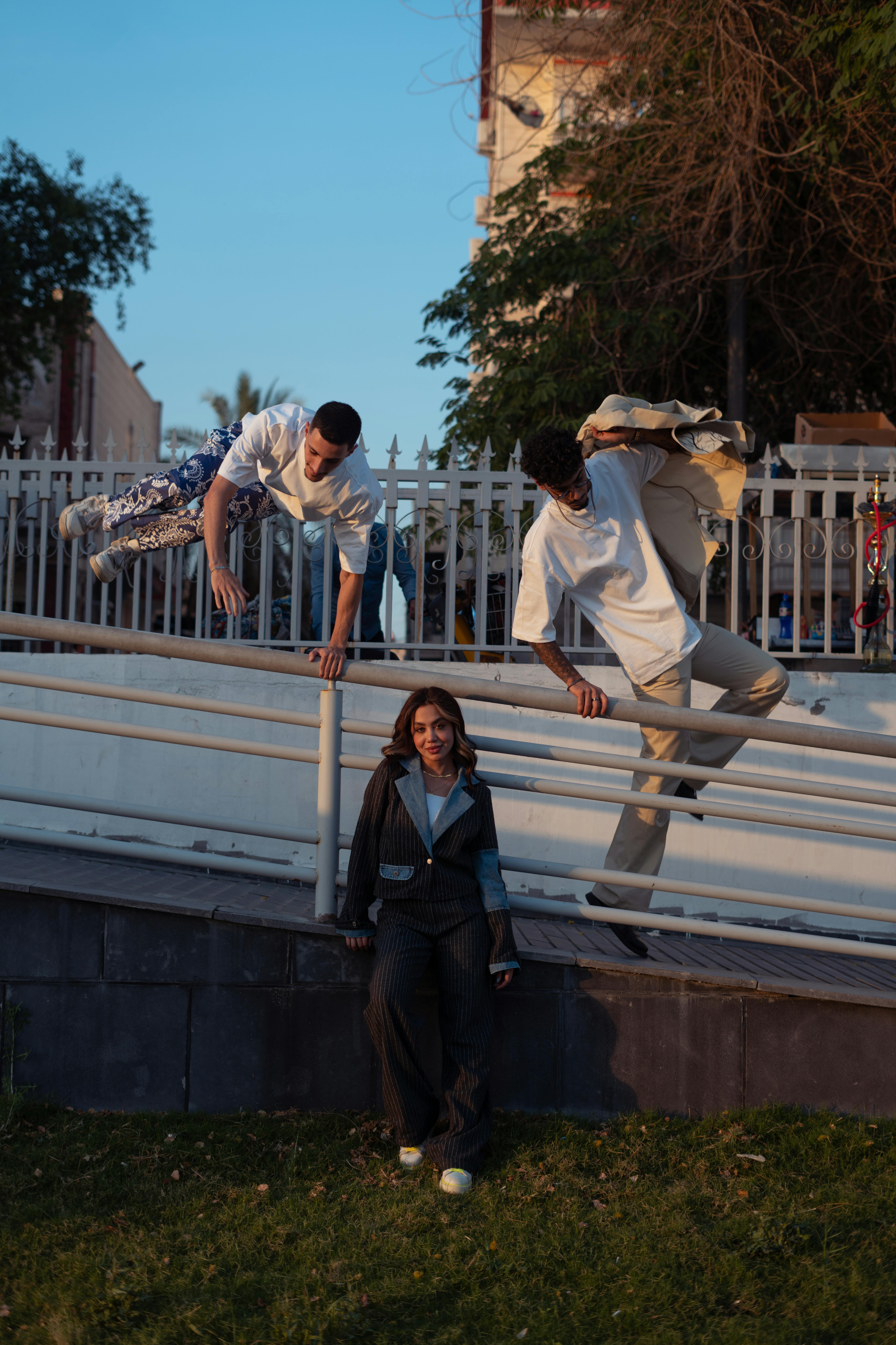 Two Men Jumping Over a Railing · Free Stock Photo