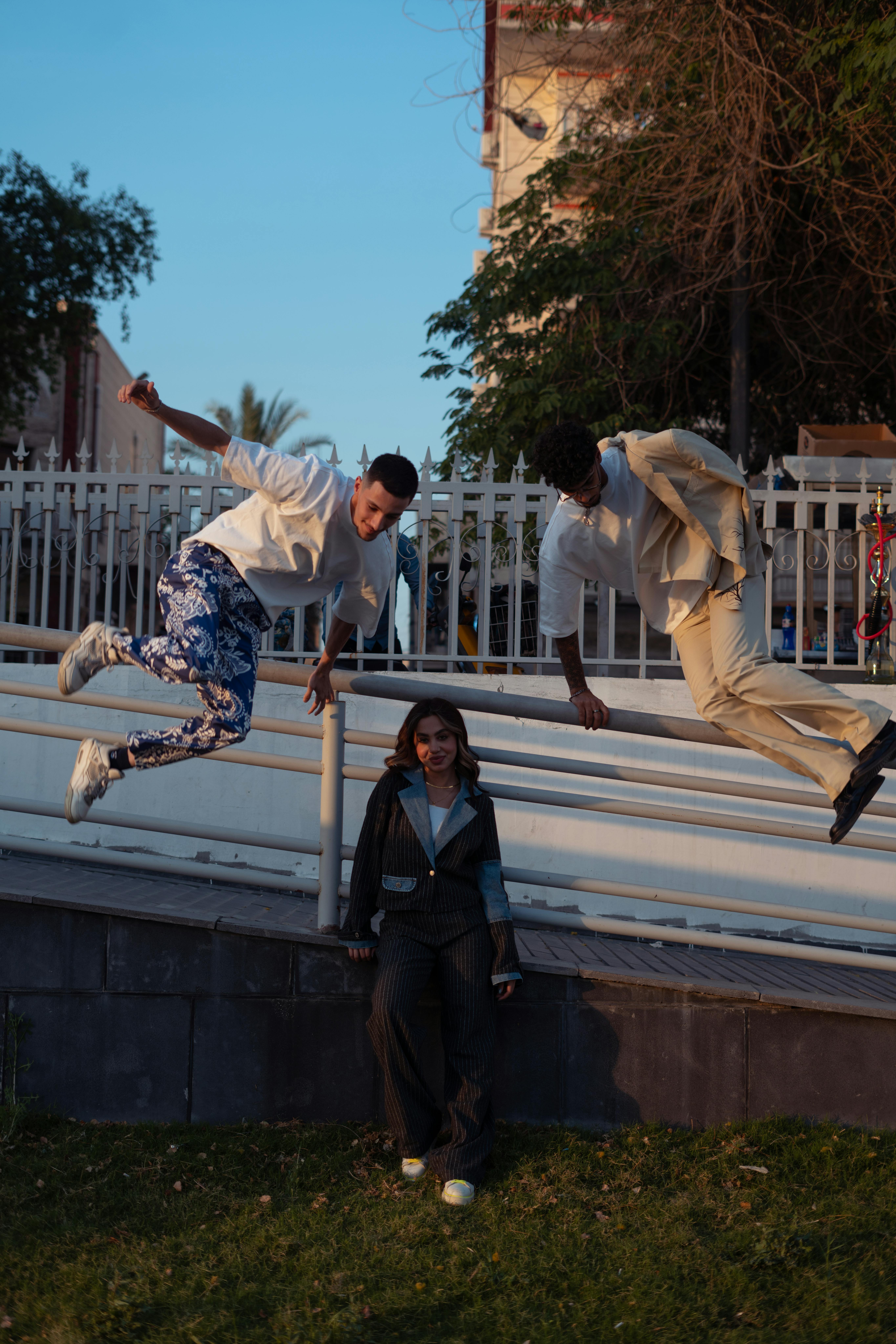 Men Jumping Off a Railing · Free Stock Photo