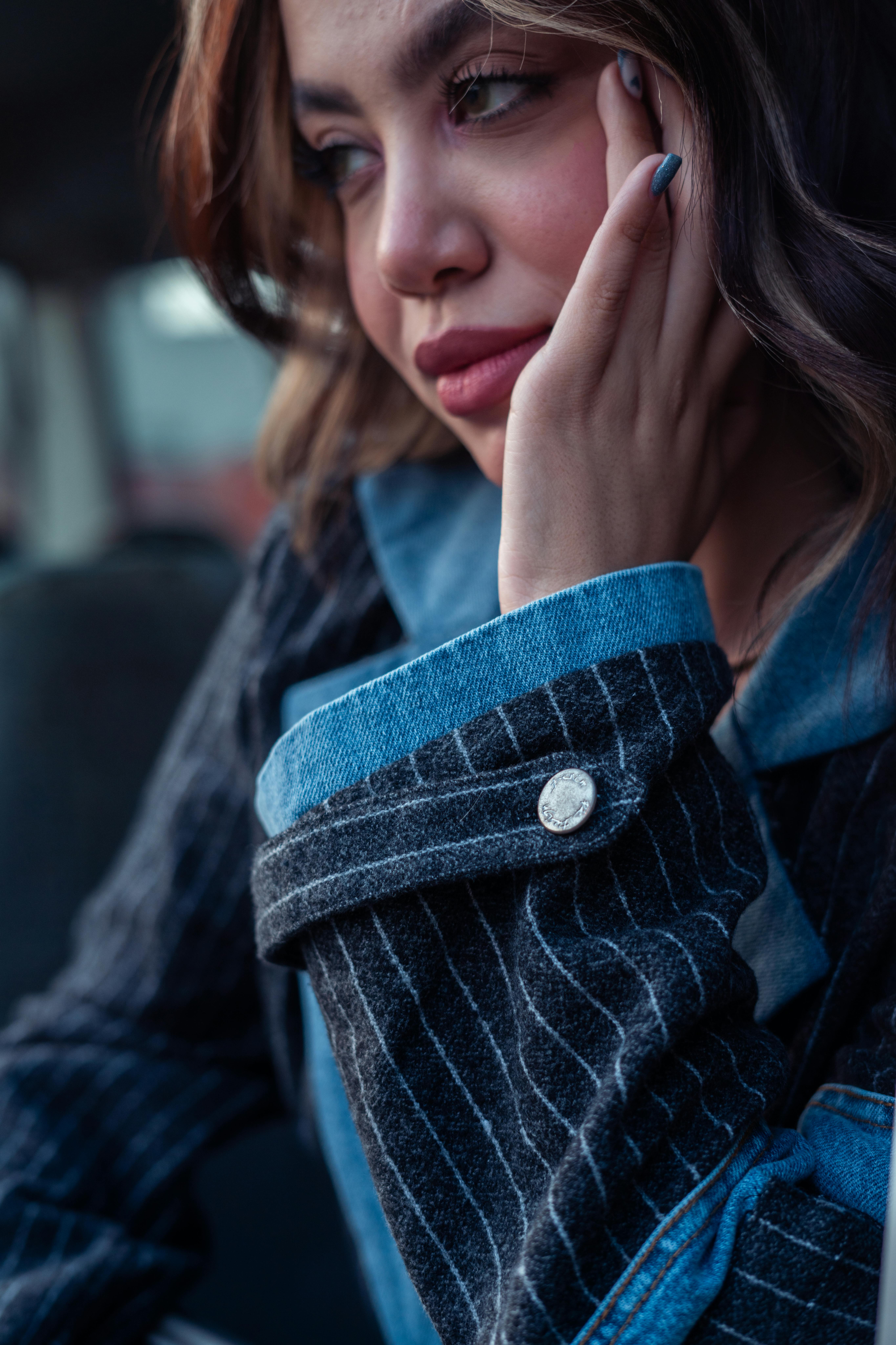 Woman with Hand on Cheek · Free Stock Photo