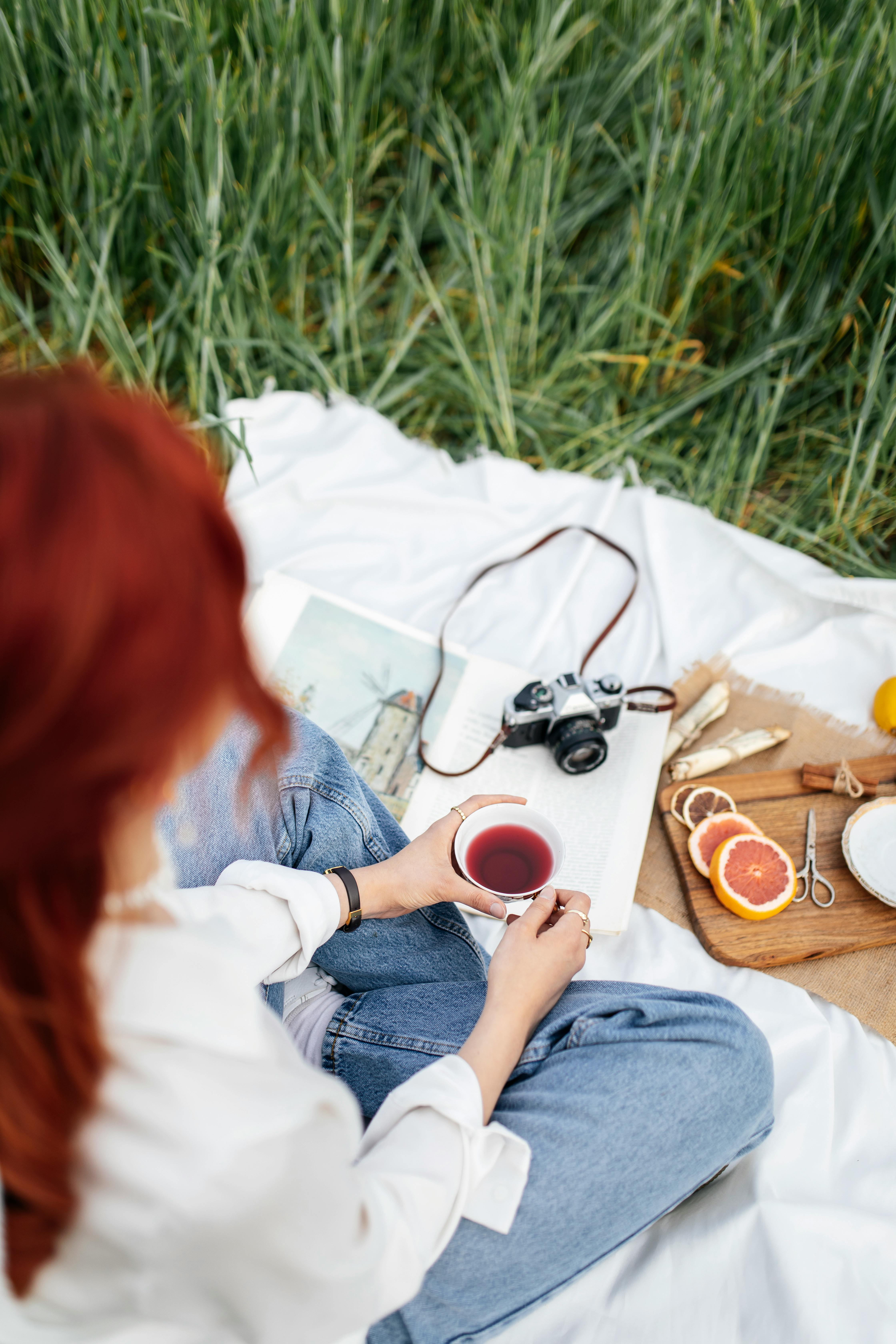 Woman Sitting with Tea on Picnic · Free Stock Photo