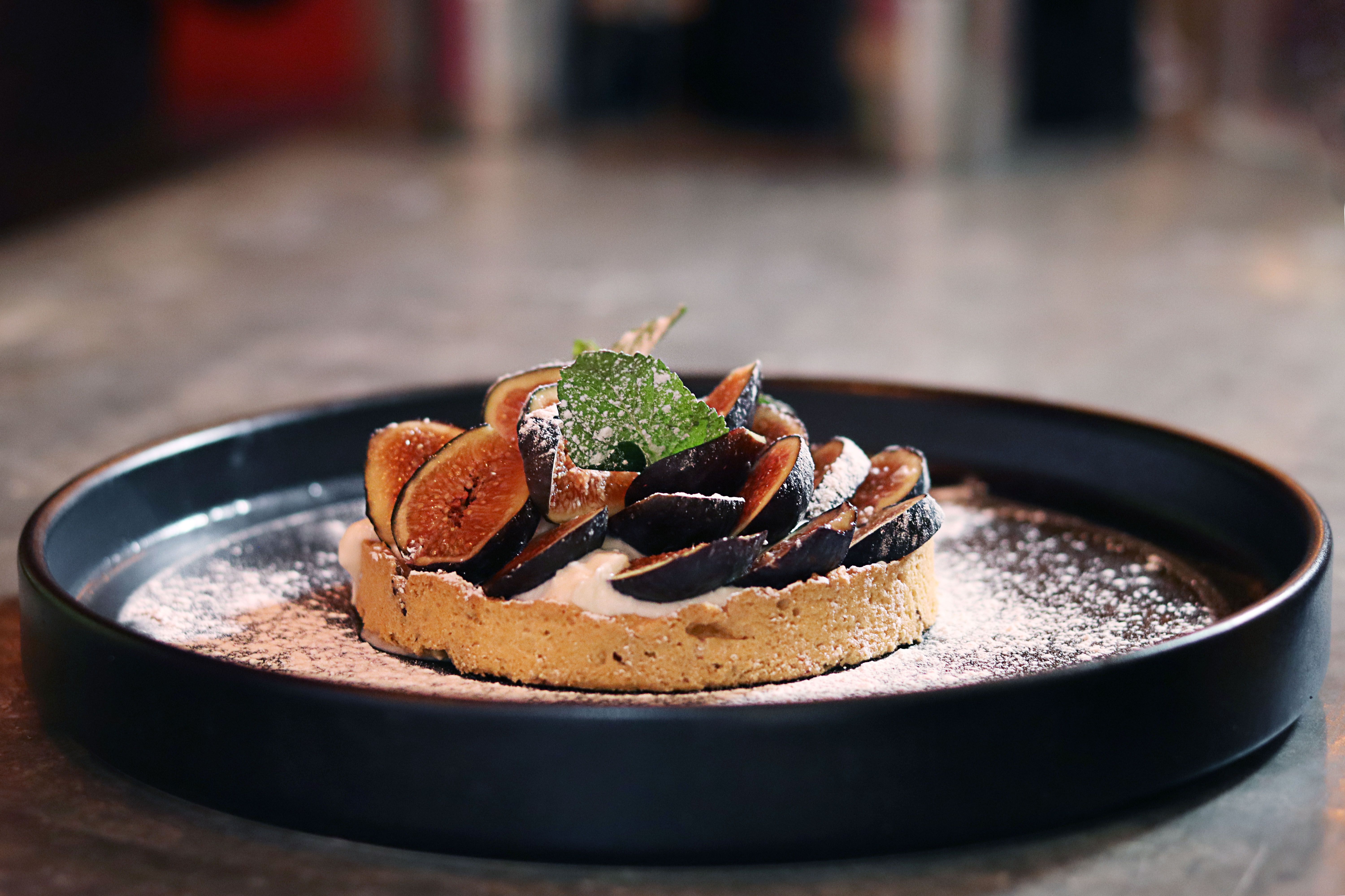 Dessert with Figs on a Black Plate · Free Stock Photo