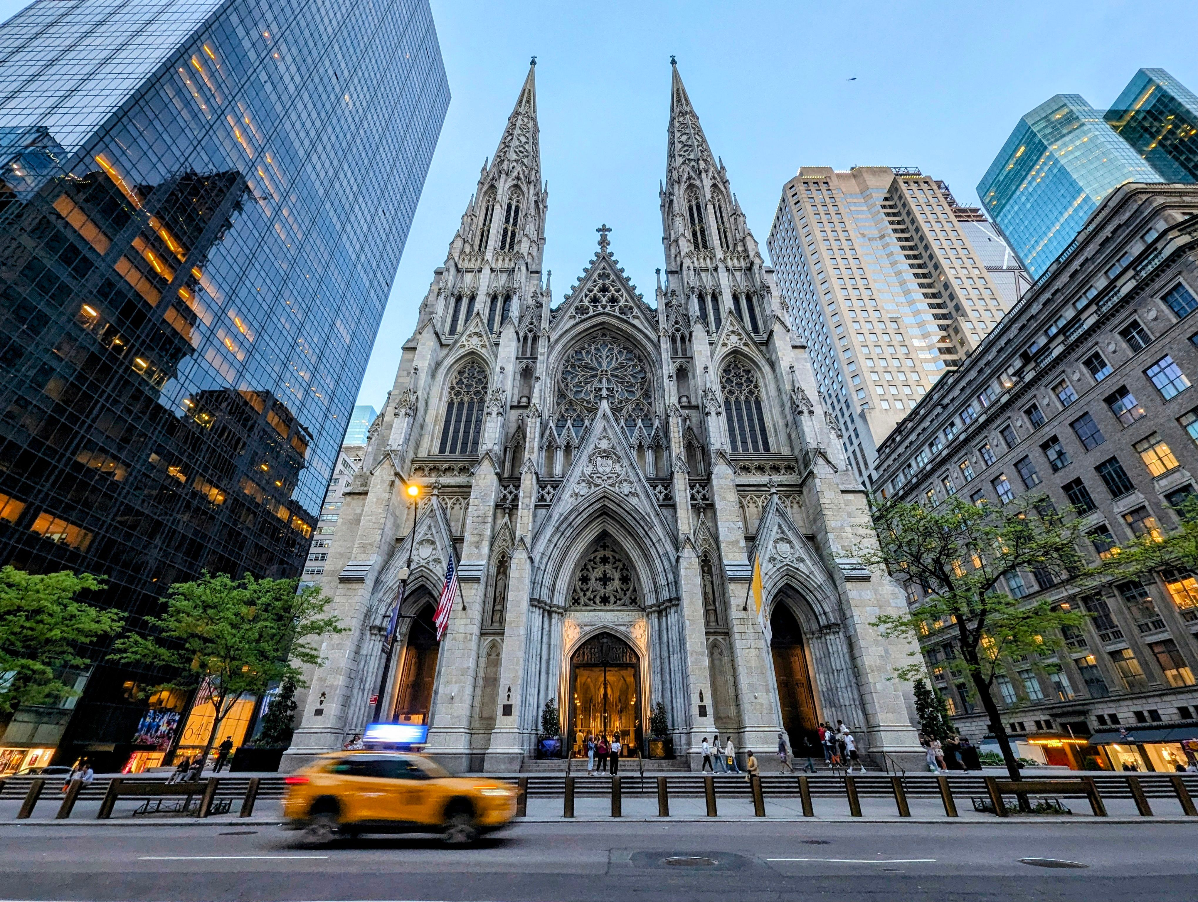Facade of St. Patricks Cathedral And Skyscrapers in New York, USA ...