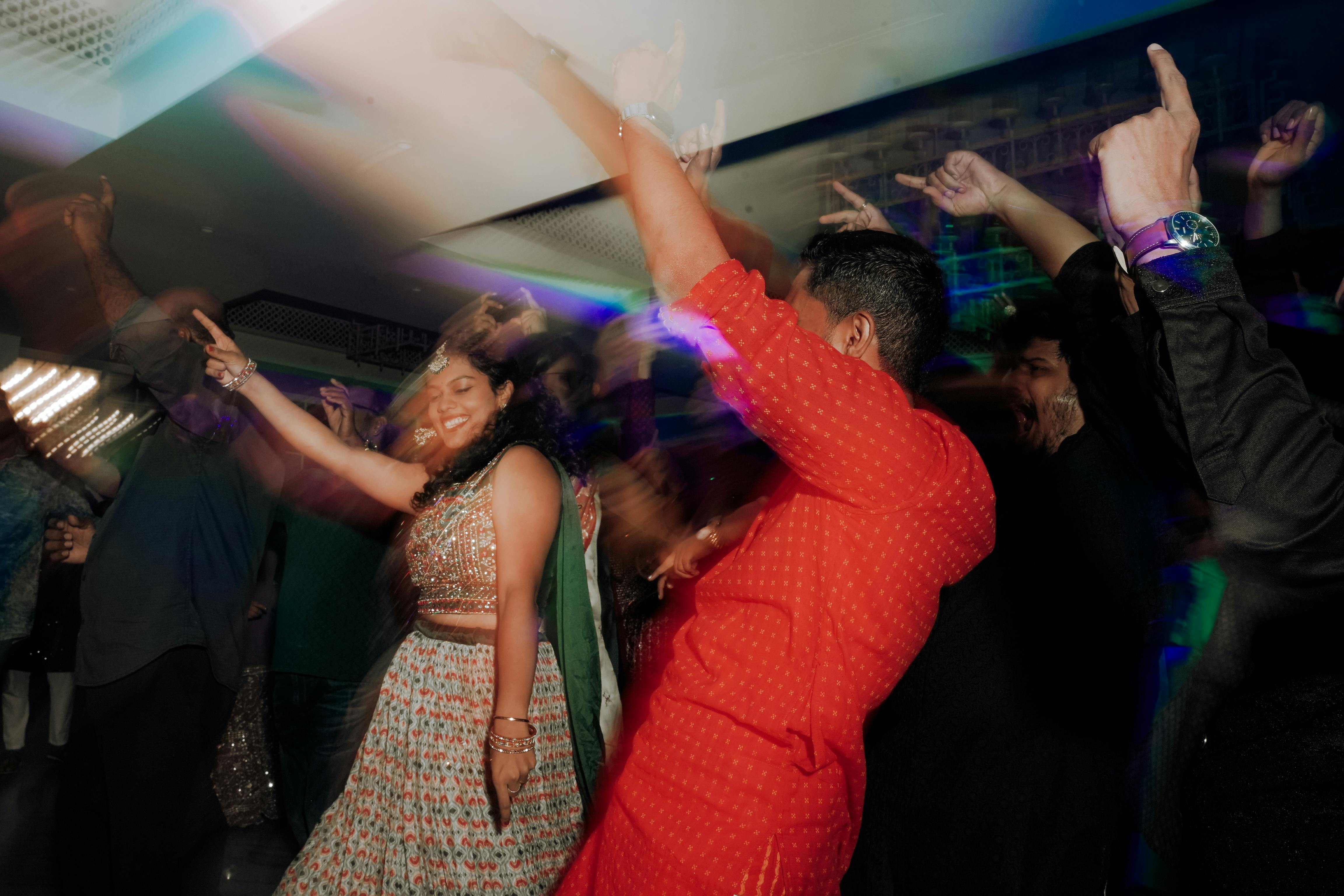 Anonymous girlfriends dancing against sunset sky · Free Stock Photo