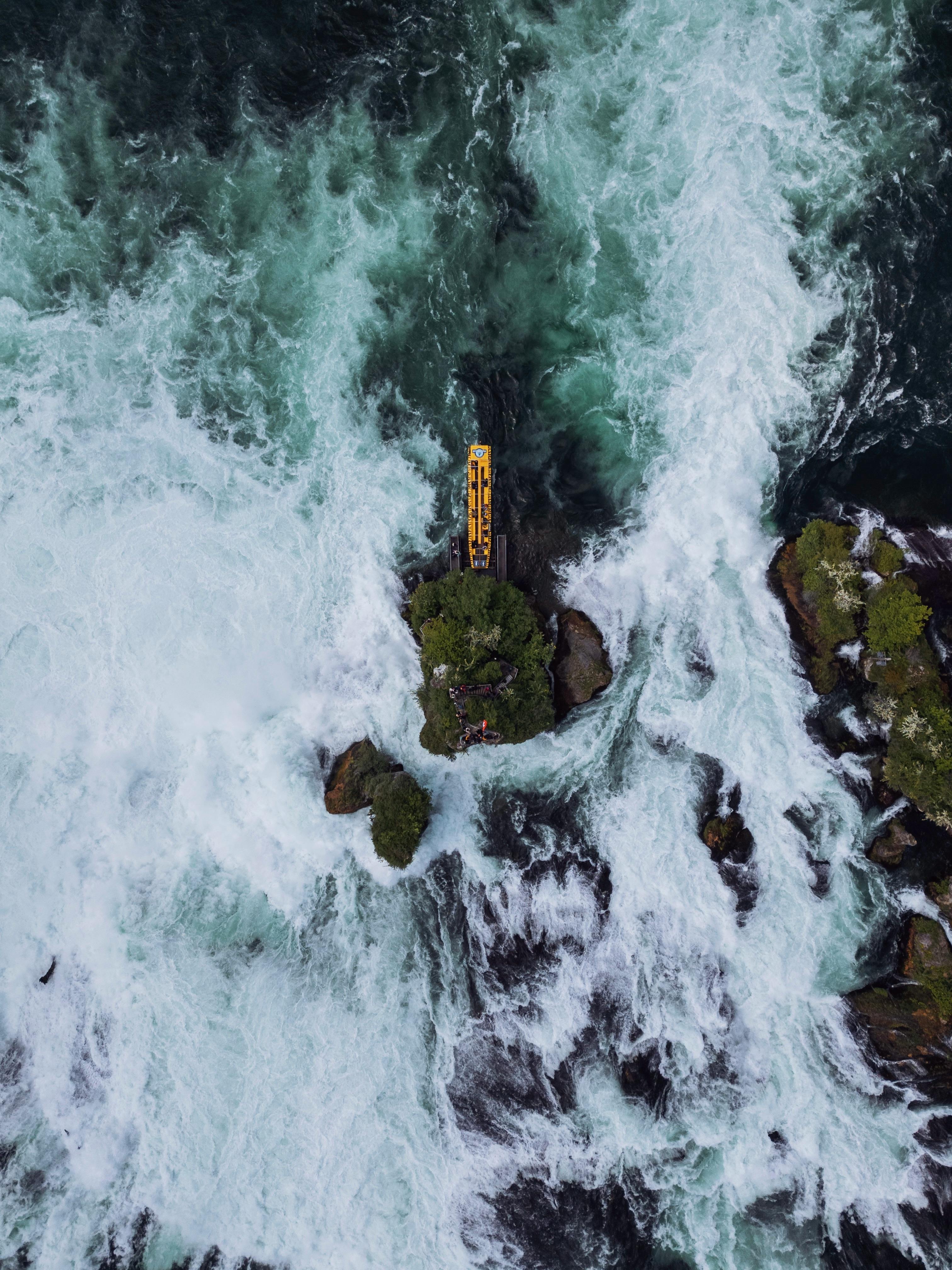 Yellow Raft on Rough Sea by Coast · Free Stock Photo