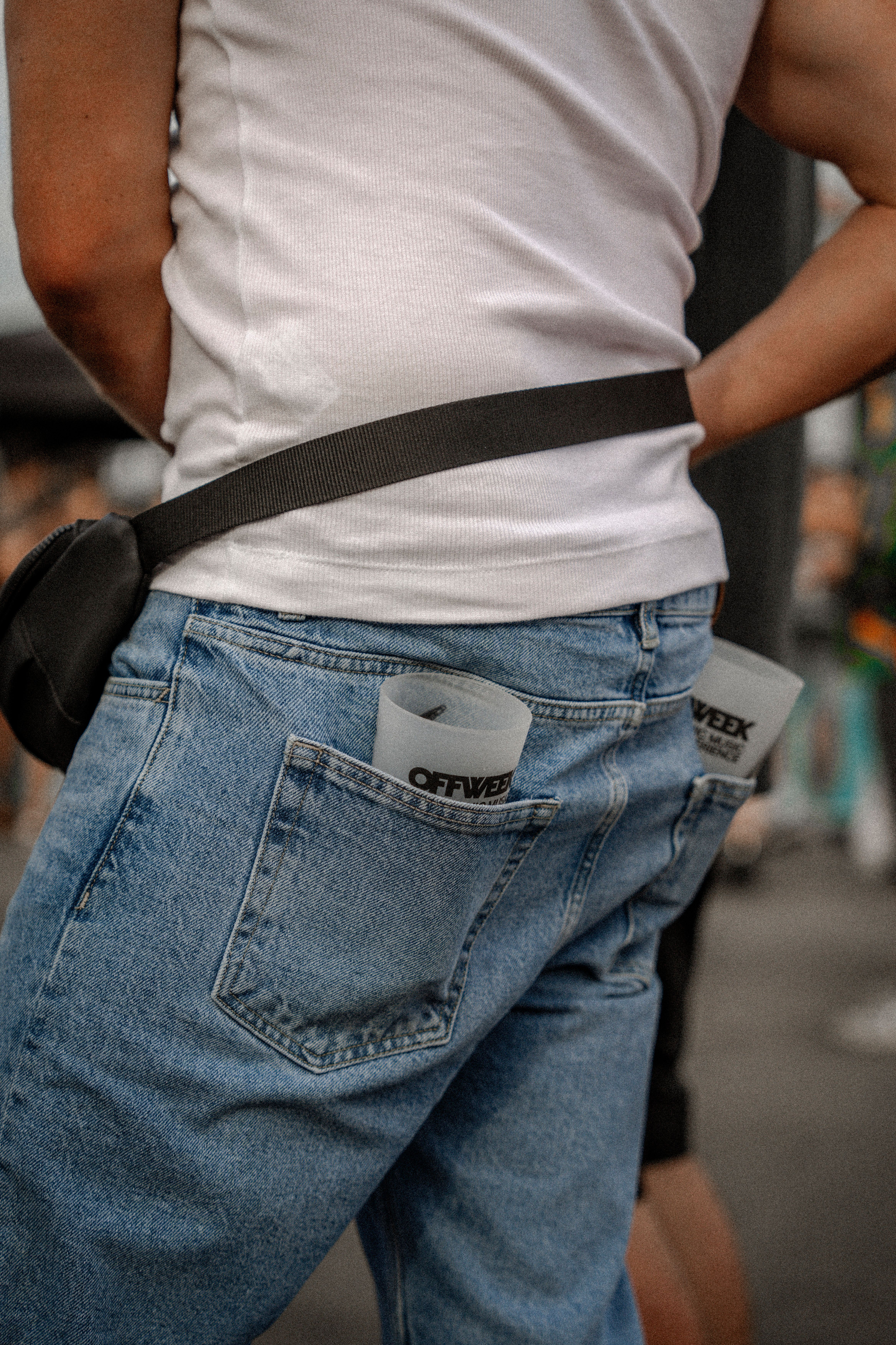 Close-up of a Man with Plastic Cups in His Back Pockets at a Festival ...