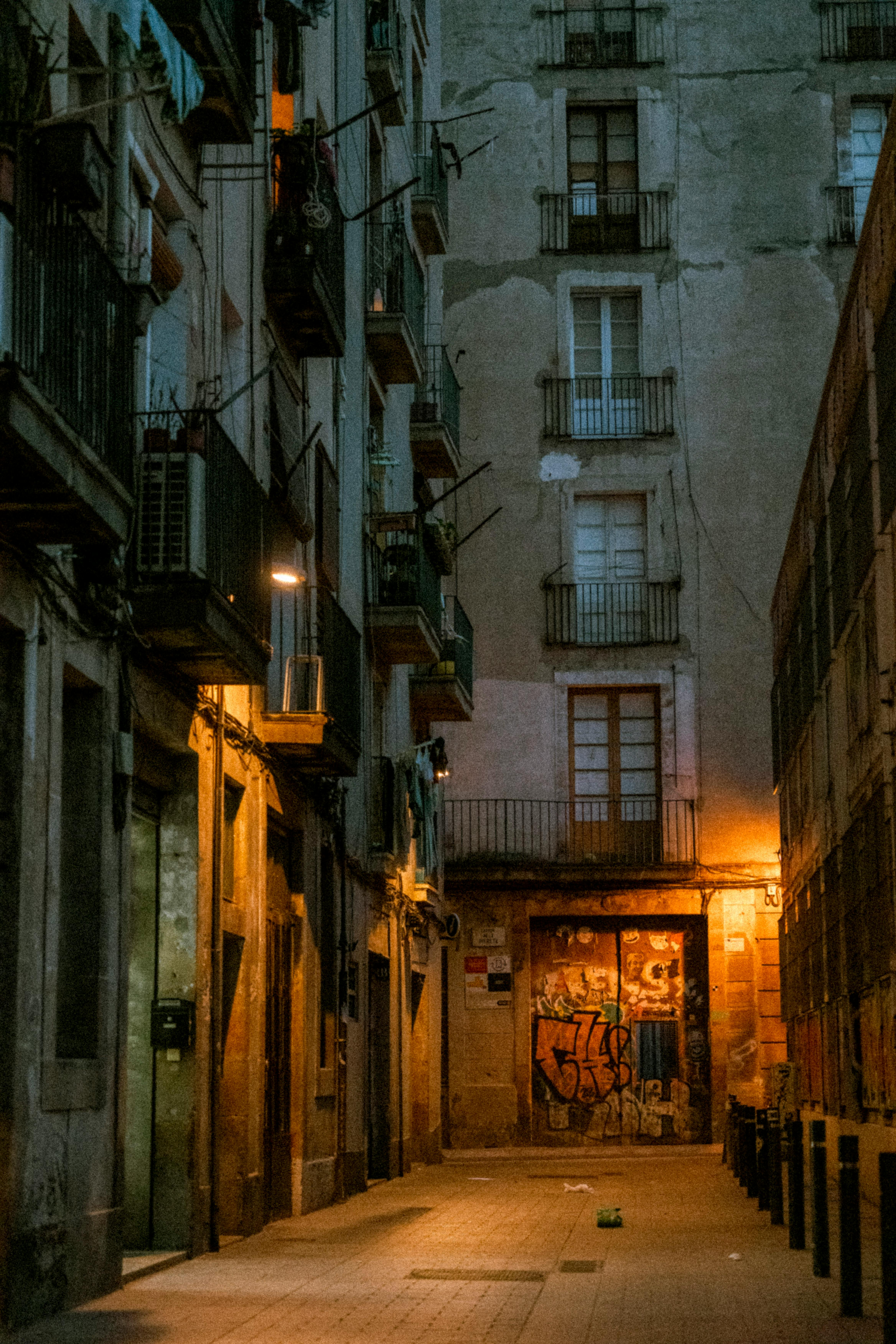 Photo of an Illuminated Alley between Apartment Buildings in a City ...
