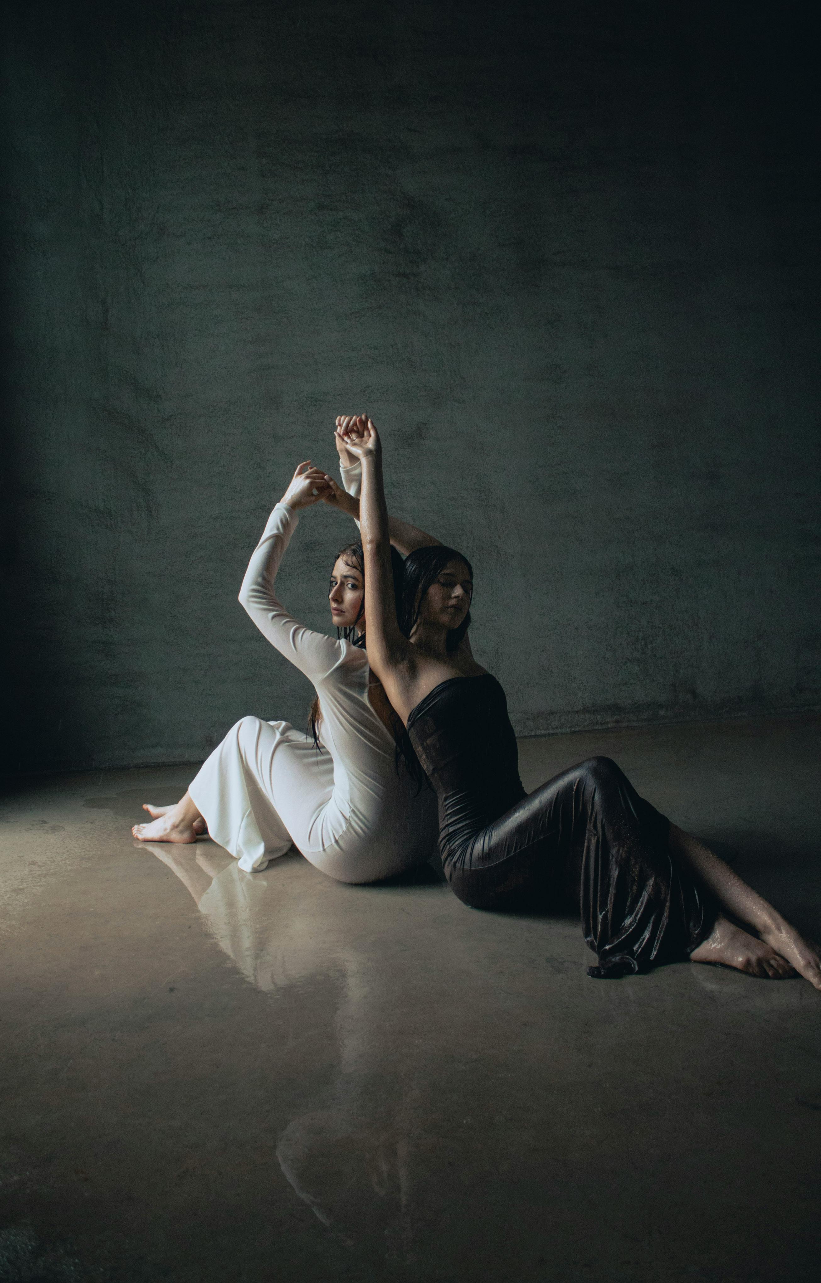 Two Women Posing on the Floor · Free Stock Photo