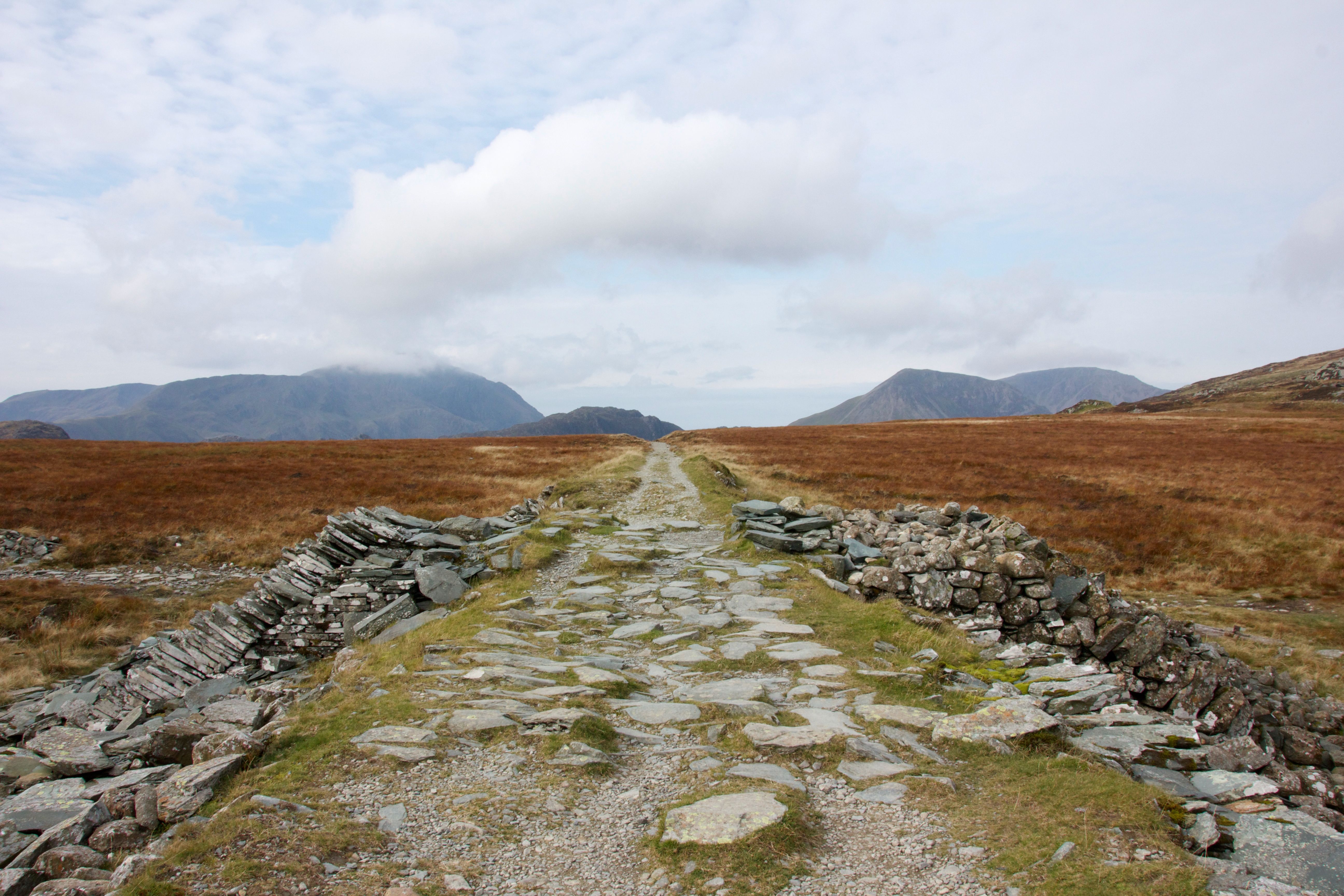Rocky Footpath with Hills in the Background · Free Stock Photo