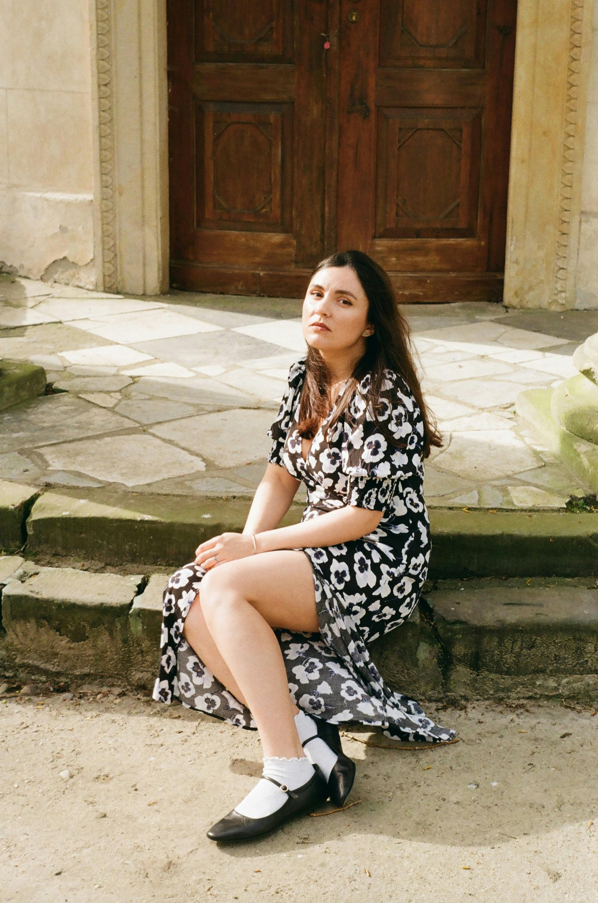 Woman in Dress Sitting on Stairs · Free Stock Photo