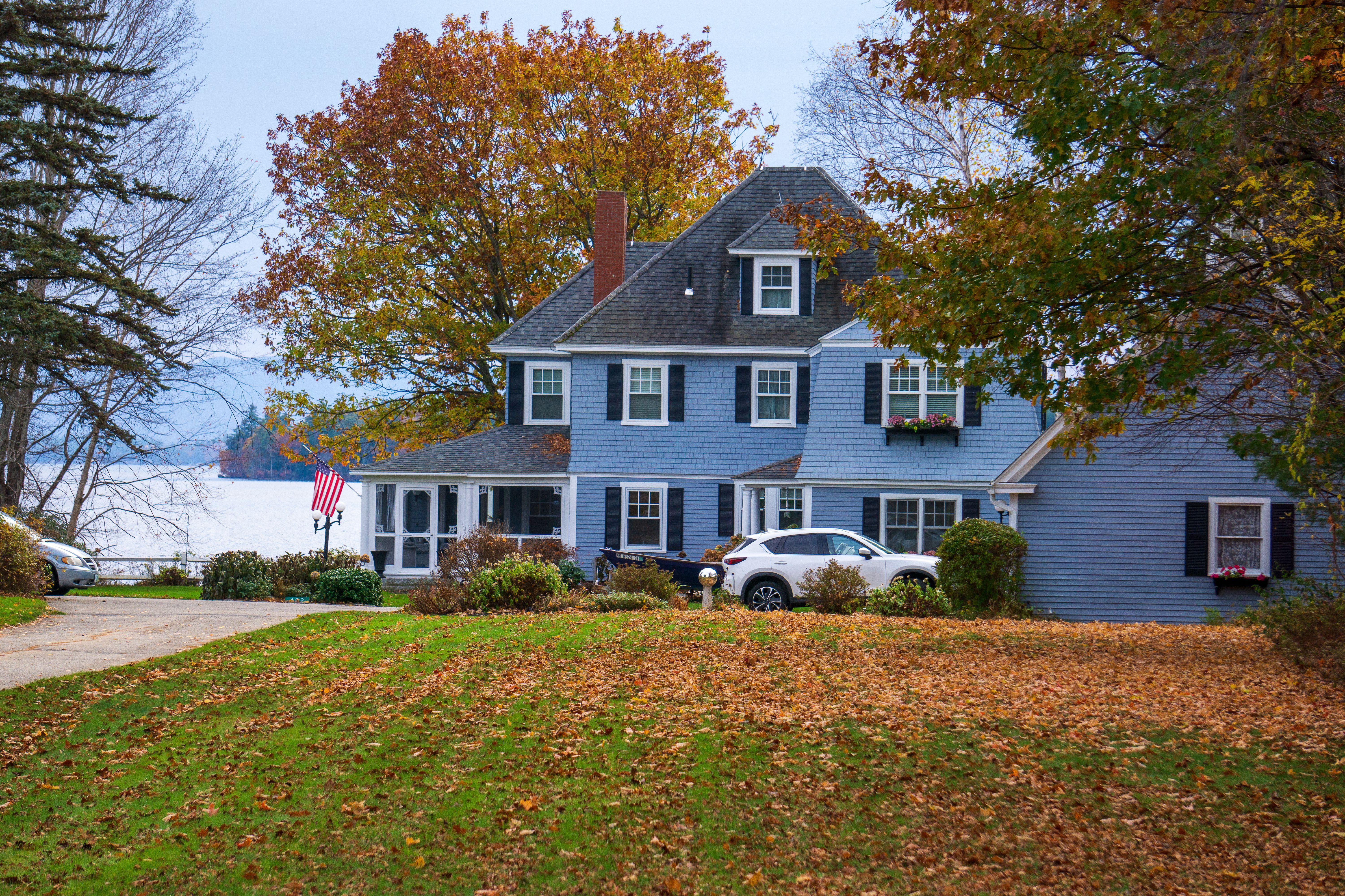 Blue Detached House by Lake · Free Stock Photo