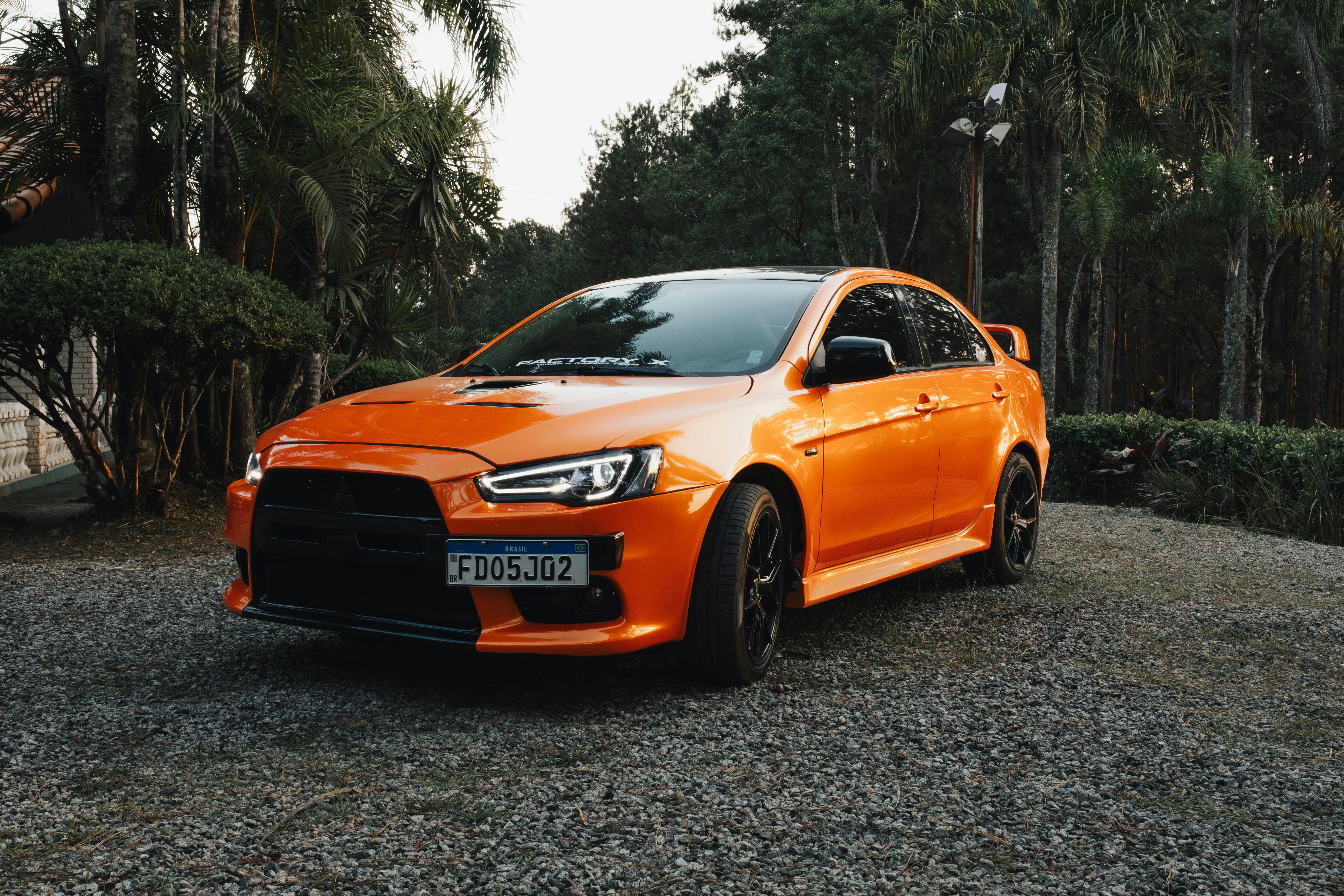 Orange Mitsubishi Lancer Evolution X Sports Sedan in the Parking Lot ...