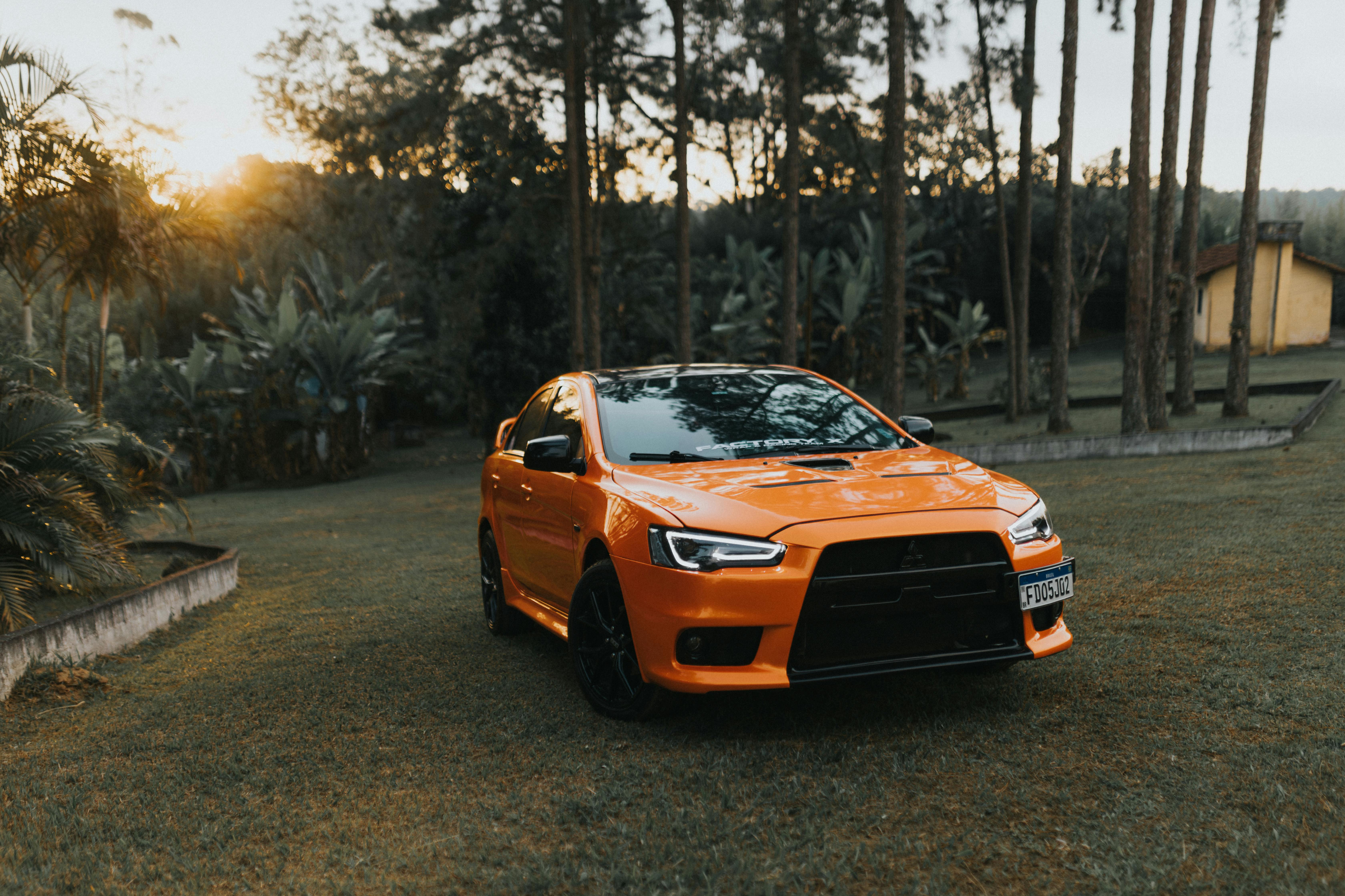 Orange Mitsubishi Lancer Evolution X Parked Under Palm Trees · Free ...